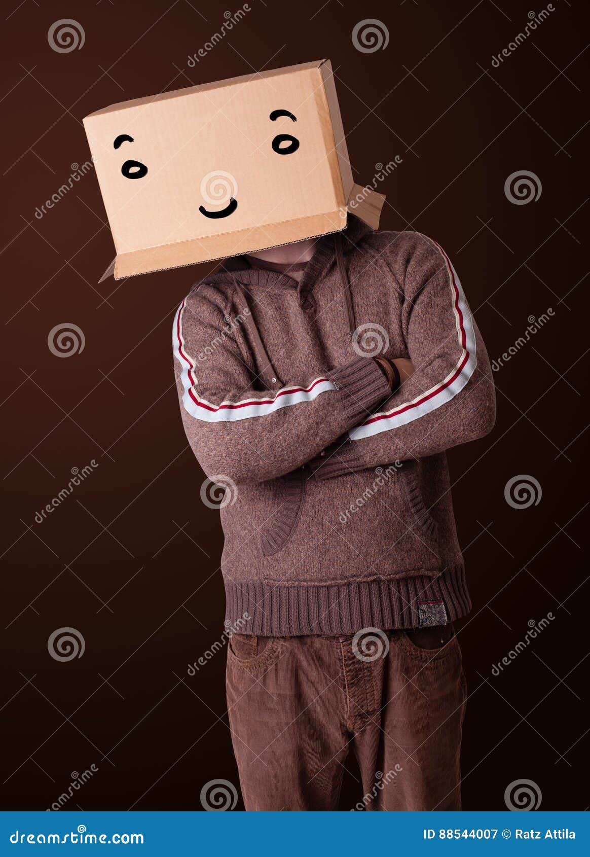 Young Man Gesturing with a Cardboard Box on His Head with Smiley Stock ...