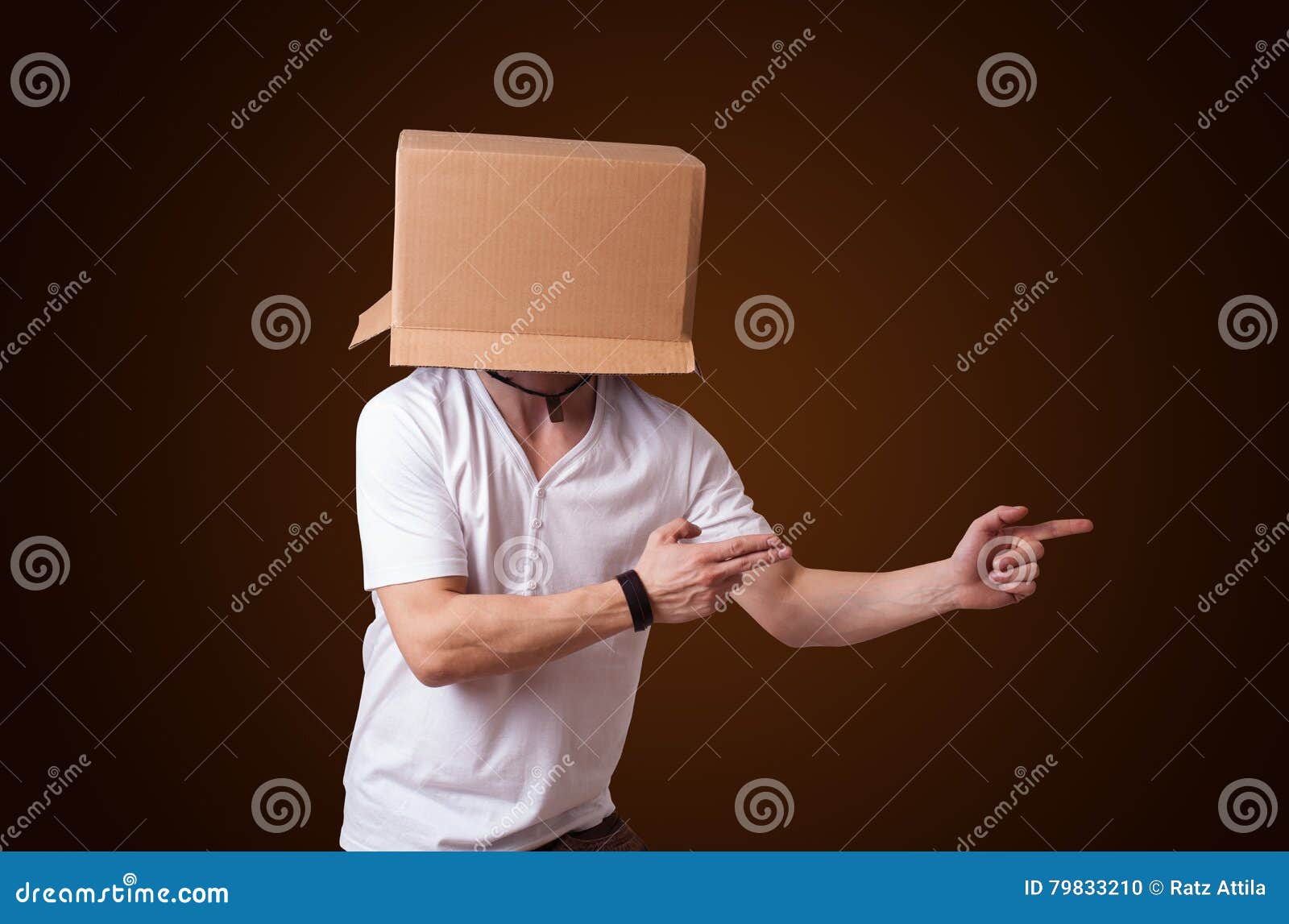 Young Man Gesturing with a Cardboard Box on His Head Stock Photo ...