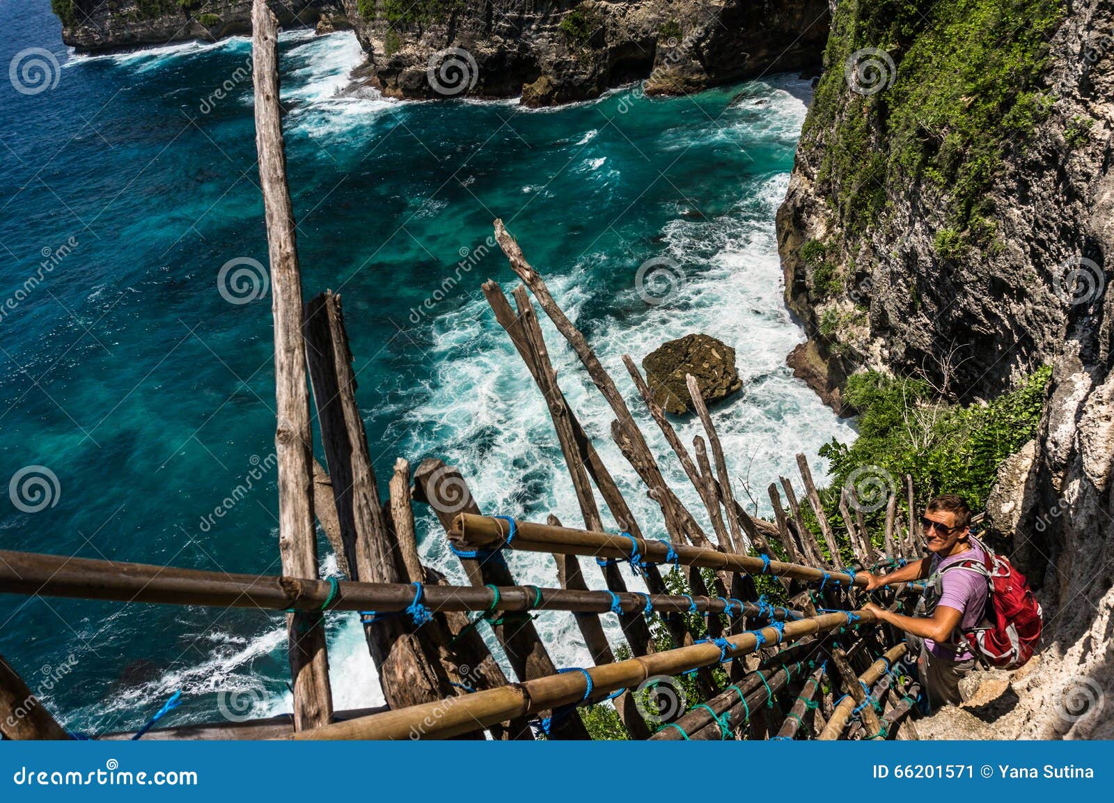 Young Man Getting Down the Cliff To Beautiful Cove Stock Image - Image ...