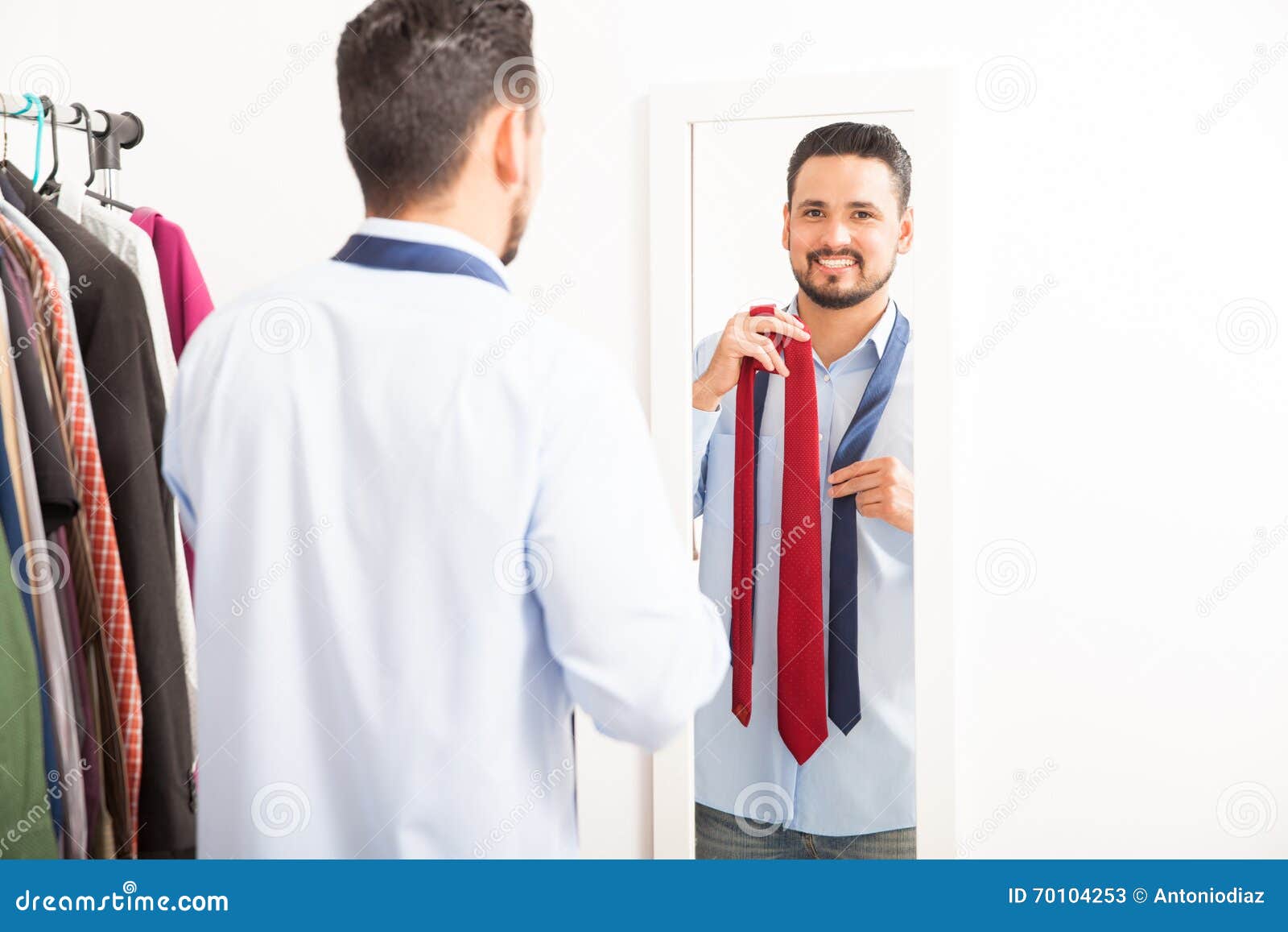 Young Man Getting Dressed in Front of a Mirror Stock Image - Image of ...