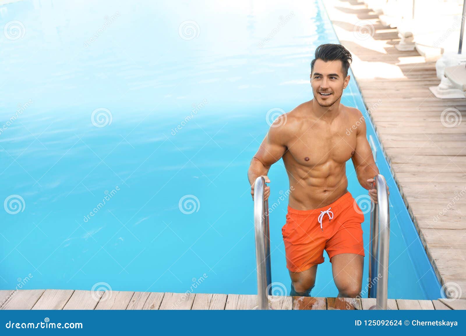 Young Man Getting Out of Outdoor Pool Stock Photo - Image of handsome ...