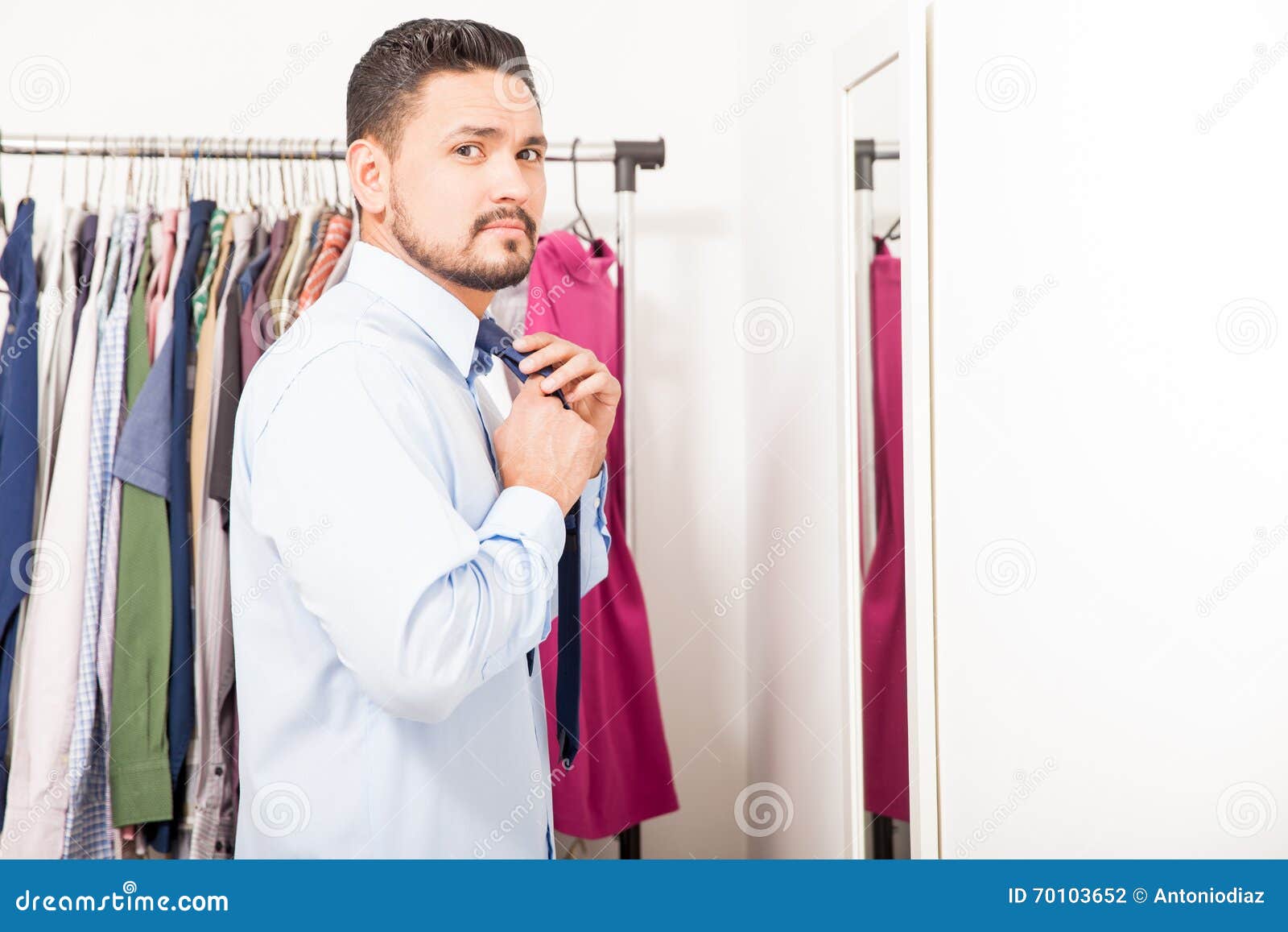 Young Man Getting Ready in a Dressing Room Stock Photo - Image of knot ...