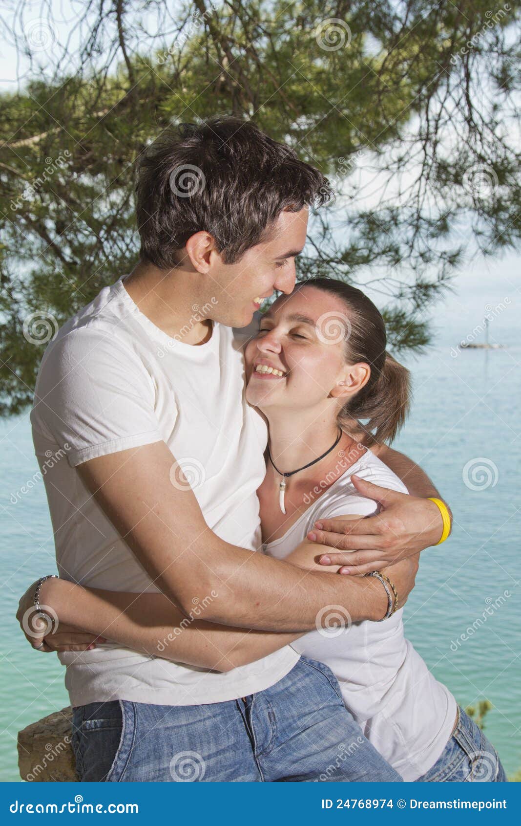 Young man and girl necking stock photo. Image of face - 24768974