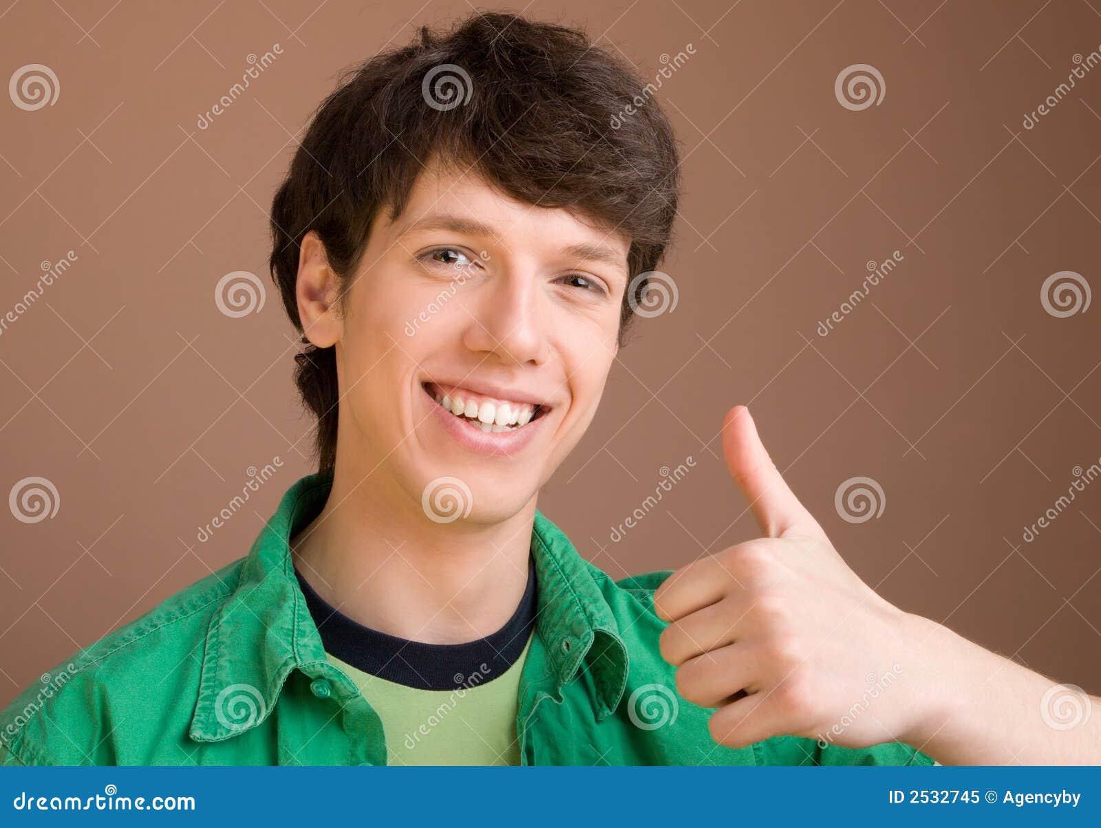 Young Man Giving a Thumbs Up Stock Image - Image of human, fellow: 2532745