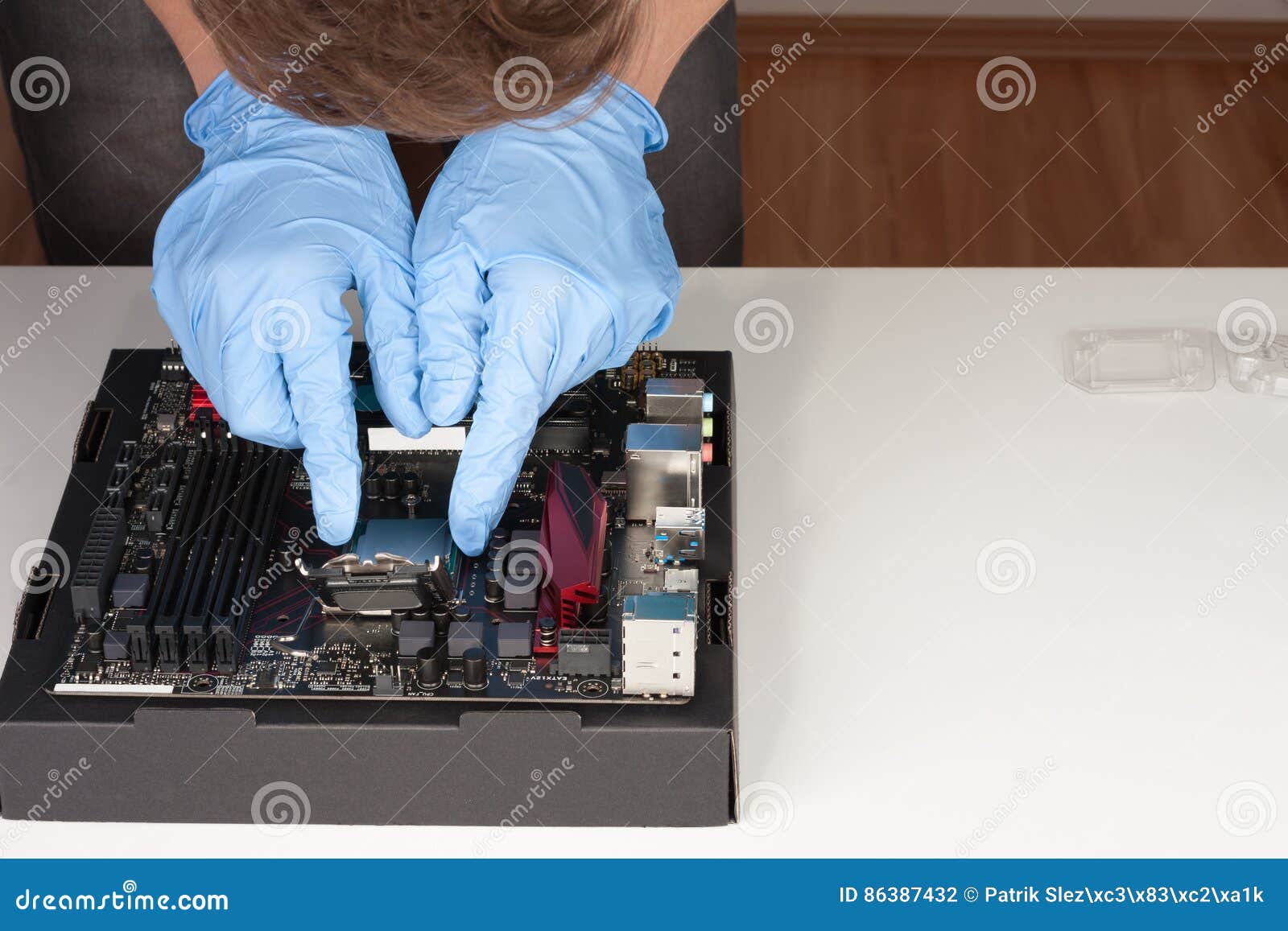Young Man with Gloves Plug in CPU on Motherboard Socket Stock Photo ...