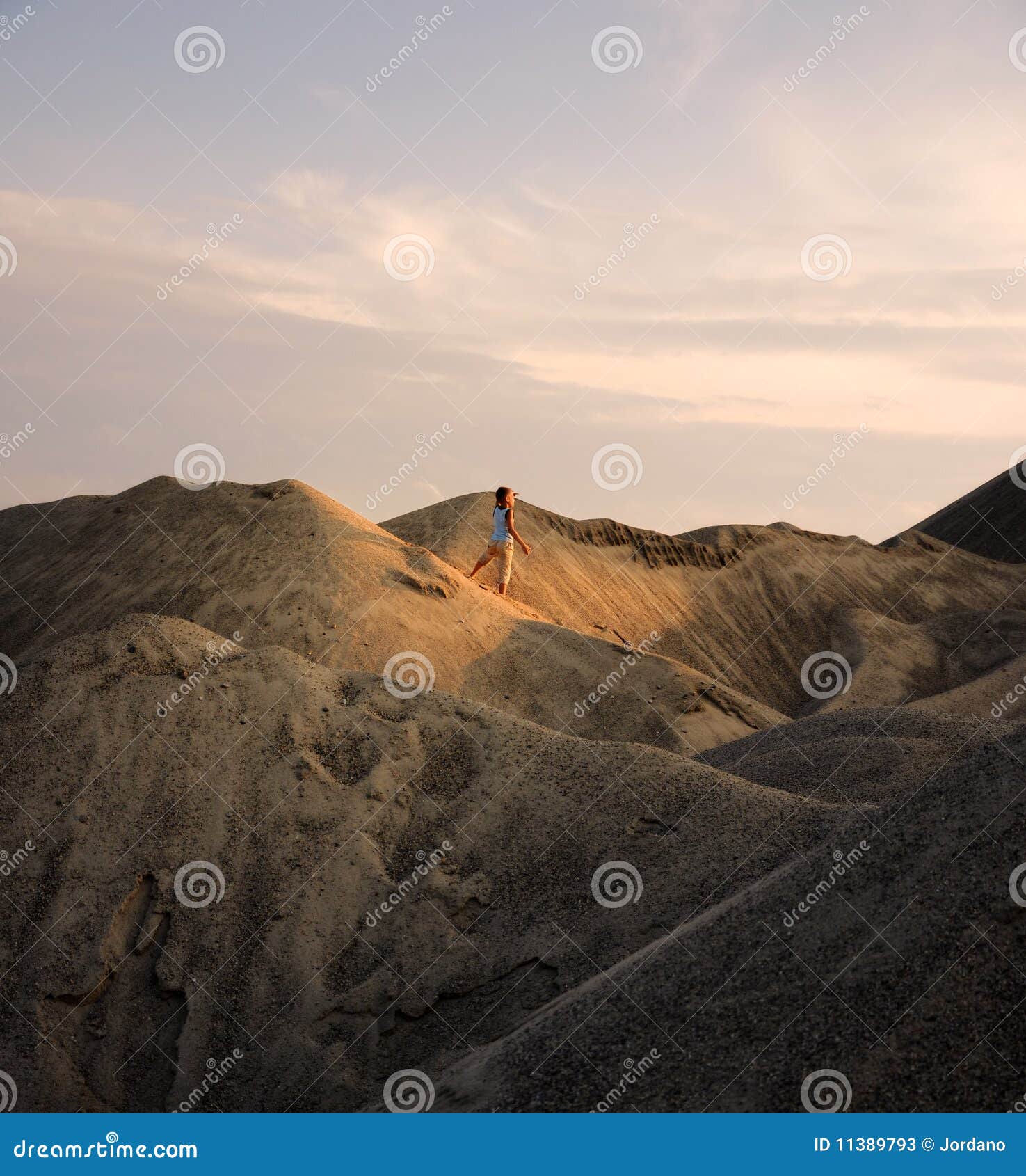 Young man go up in sand stock image. Image of active - 11389793