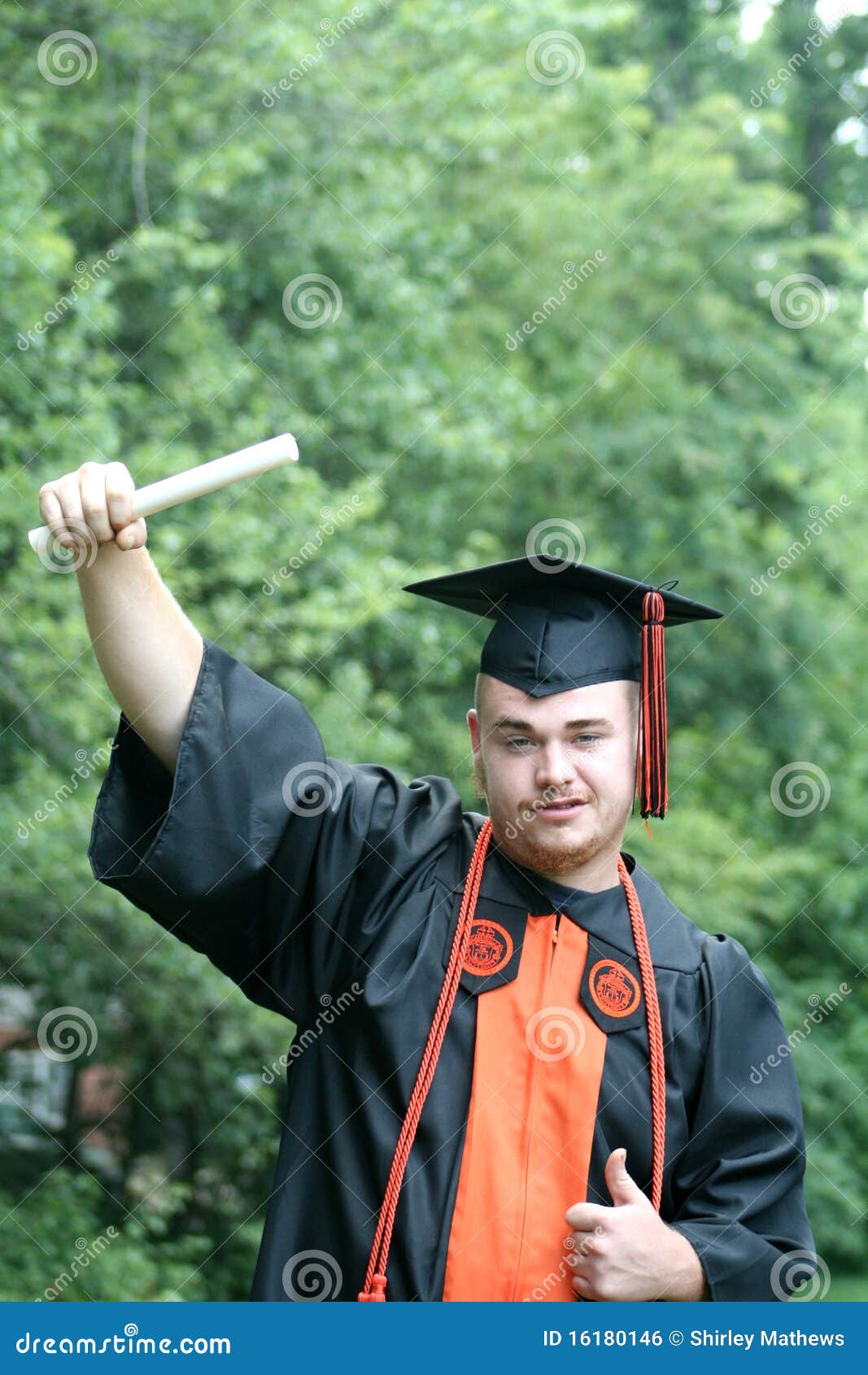 Young man graduating stock photo. Image of gown, school - 16180146