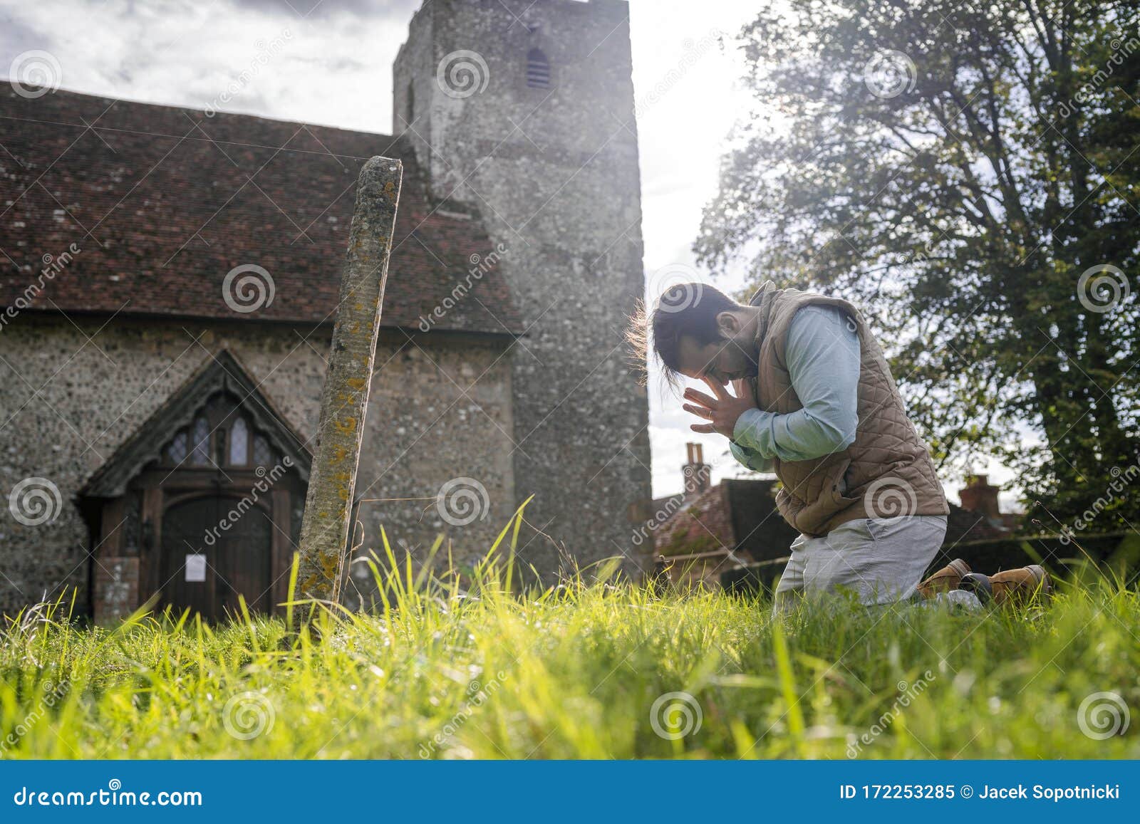 A Young Man Grieving in the Old Graveyard Stock Image - Image of final ...