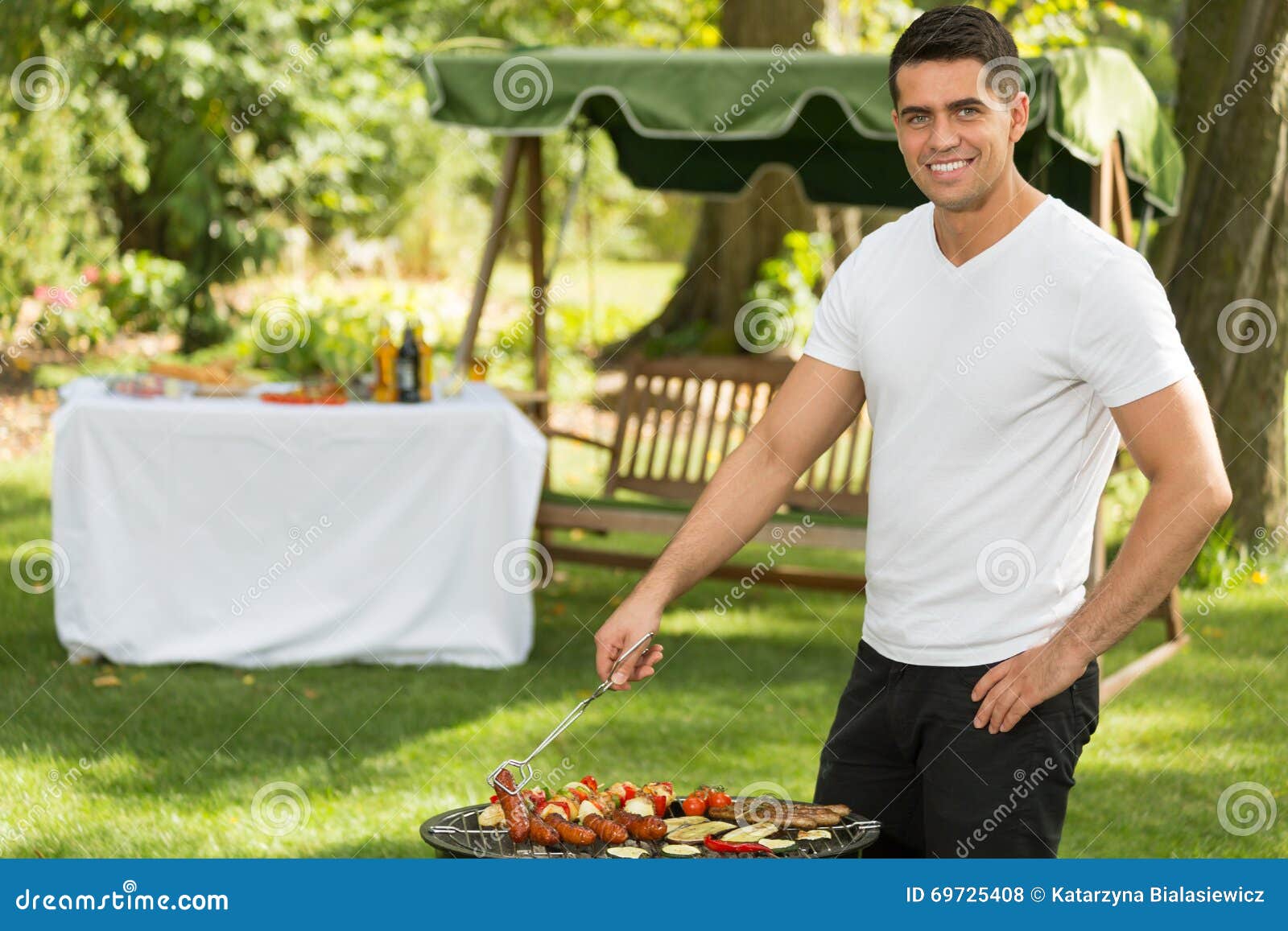 Young man grilling stock photo. Image of dinner, shashlik - 69725408