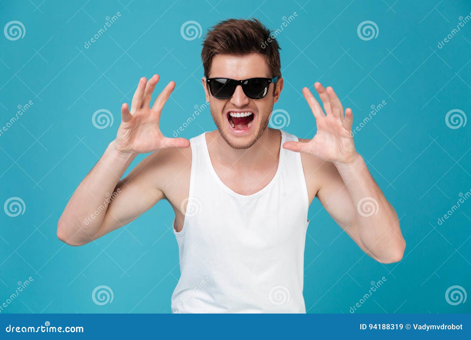 Young Man Grimacing at Camera Stock Image - Image of modern, scream ...