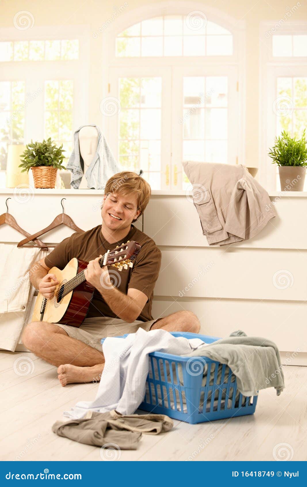 Young Man with Guitar and Laundry Stock Image - Image of basket ...