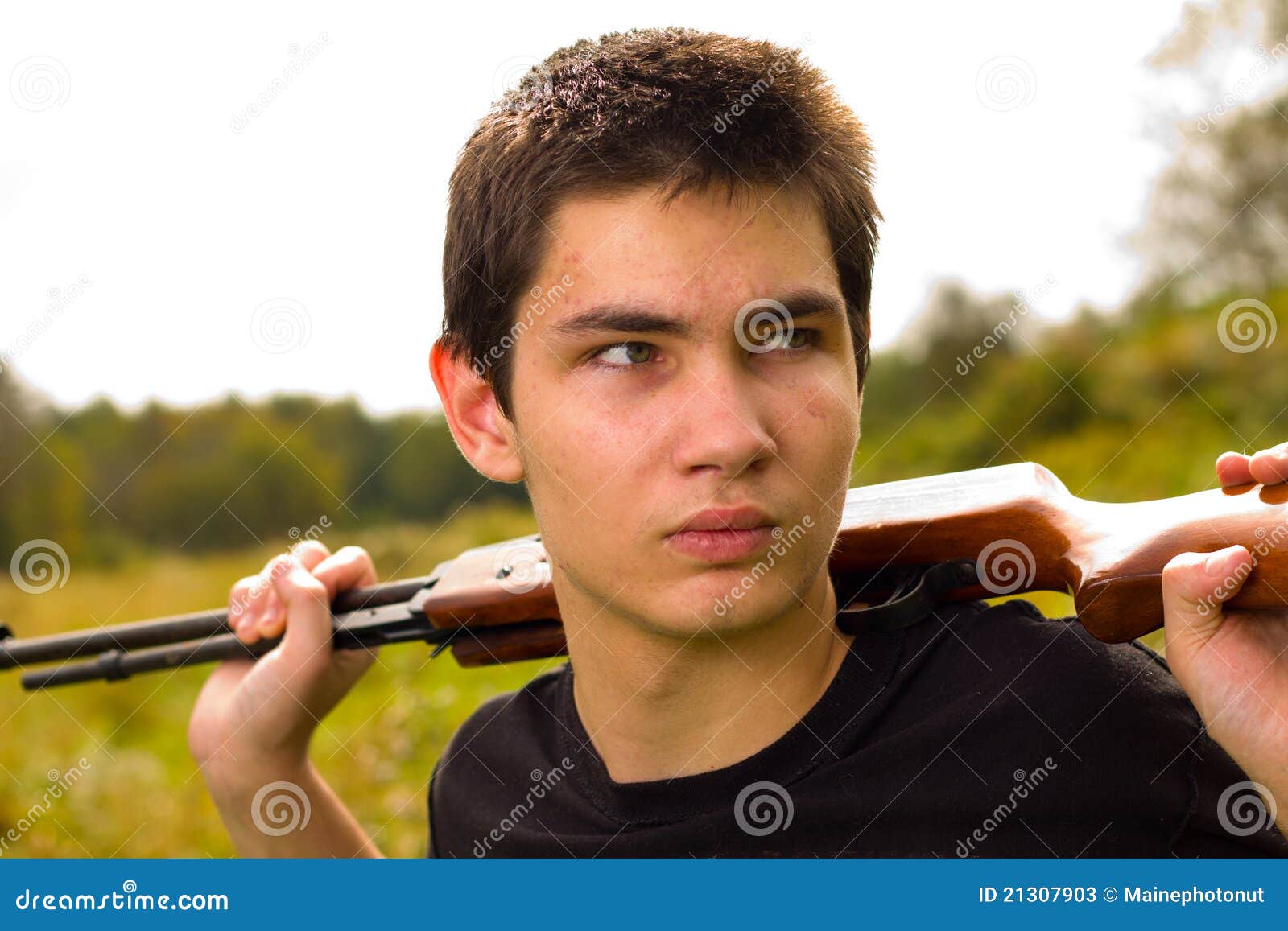 Young Man with Gun or Rifle Stock Image - Image of barrel, field: 21307903