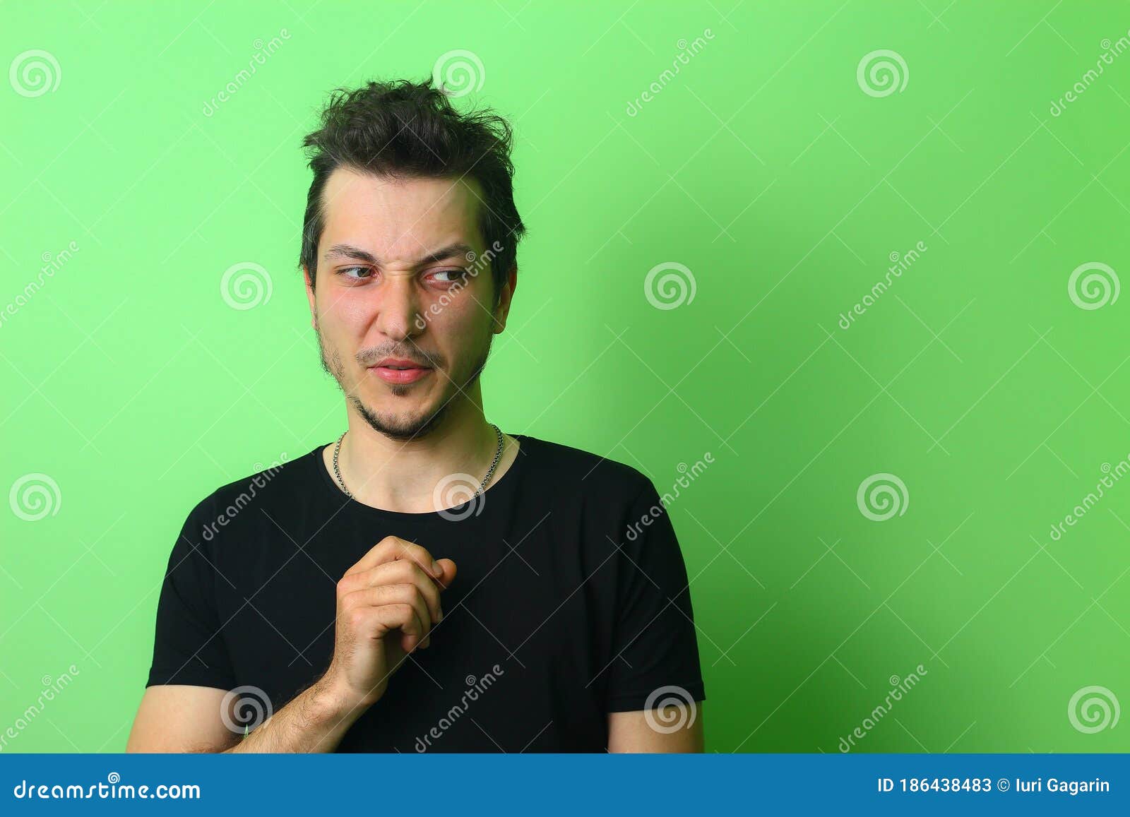 Young Man or Guy on a Light Green Background. Emotion of Contempt Stock ...
