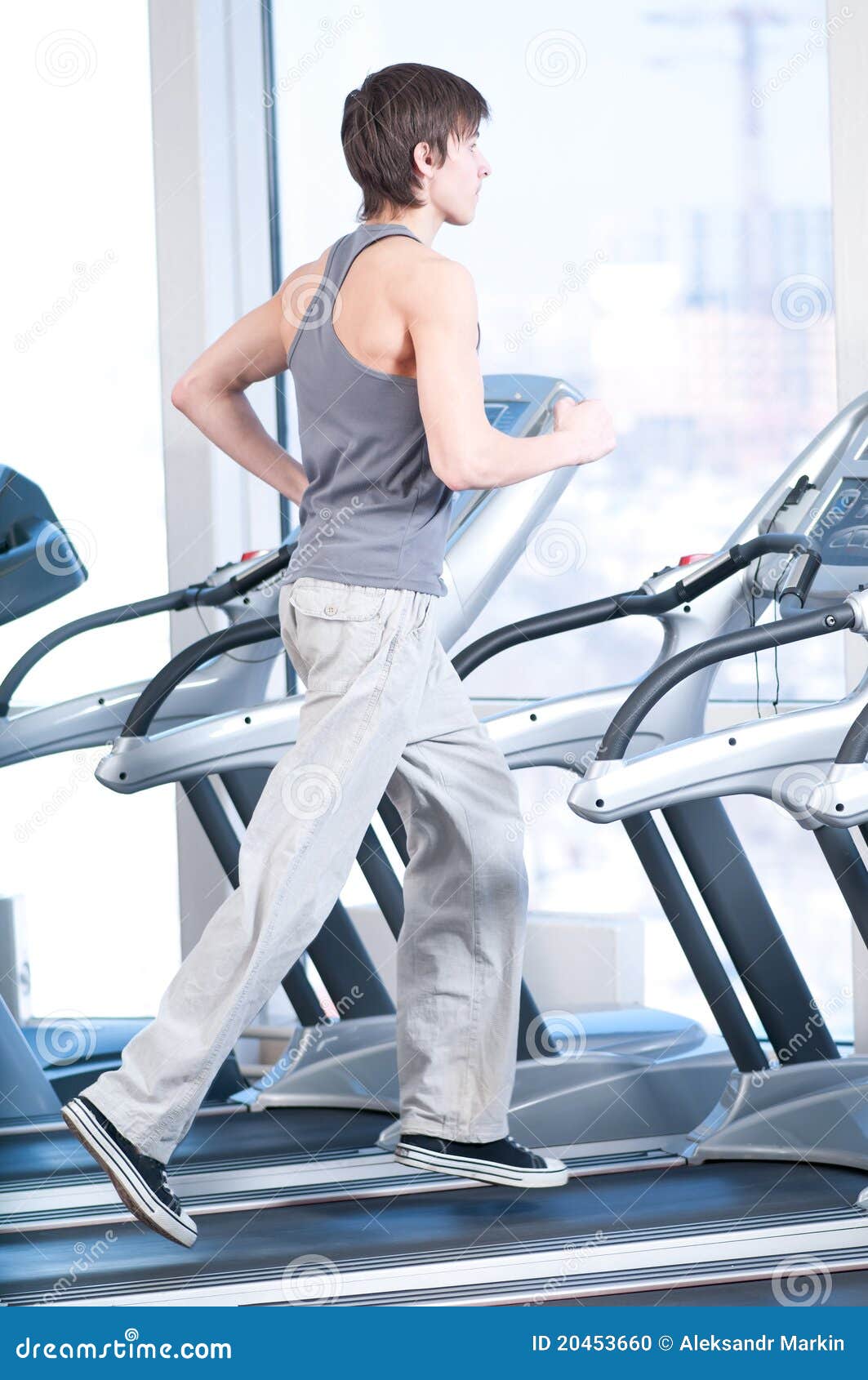 Young Man at the Gym Exercising. Running Stock Photo - Image of energy ...