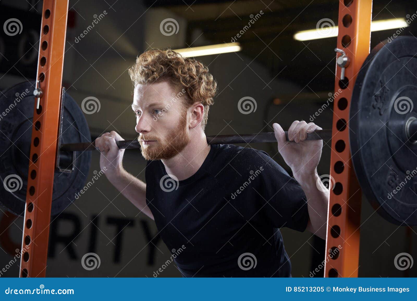 Young Man in Gym Lifting Weights on Barbell Stock Image - Image of male ...