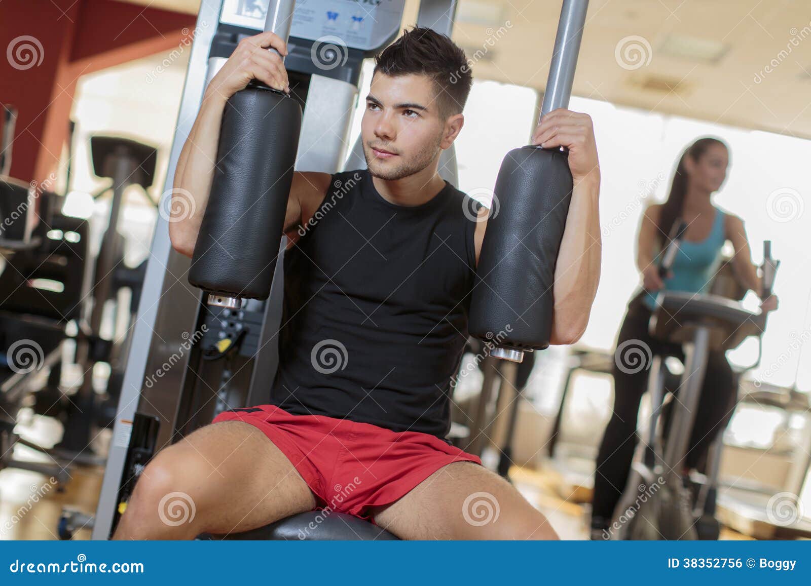 Young man in the gym stock photo. Image of health, muscle - 38352756