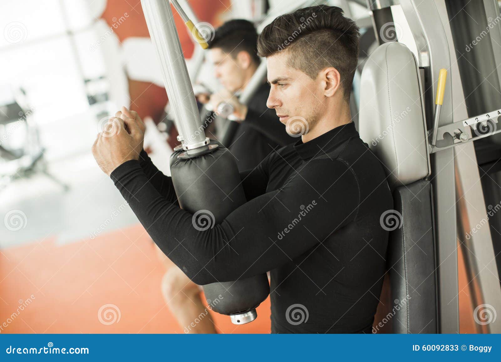 Young man in the gym stock image. Image of equipment - 60092833