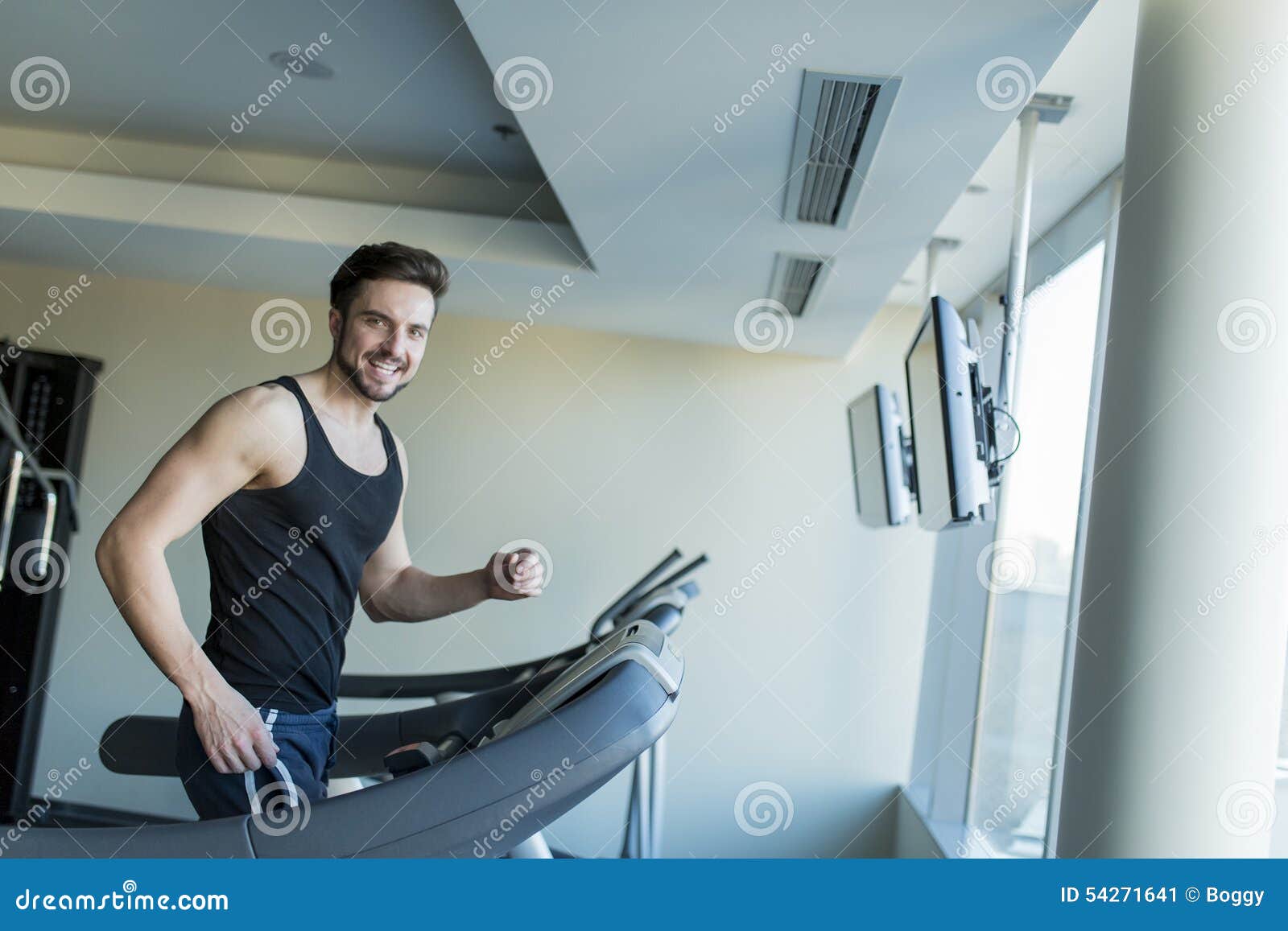 Young man in the gym stock image. Image of walking, treadmill - 54271641