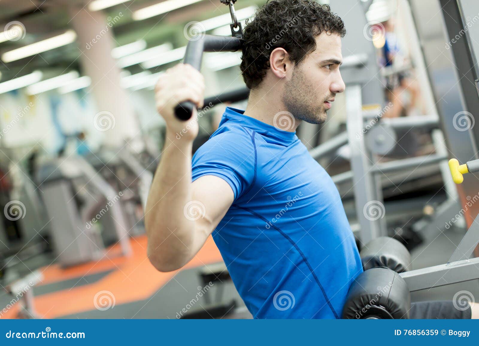 Young man in the gym stock image. Image of indoor, workout - 76856359