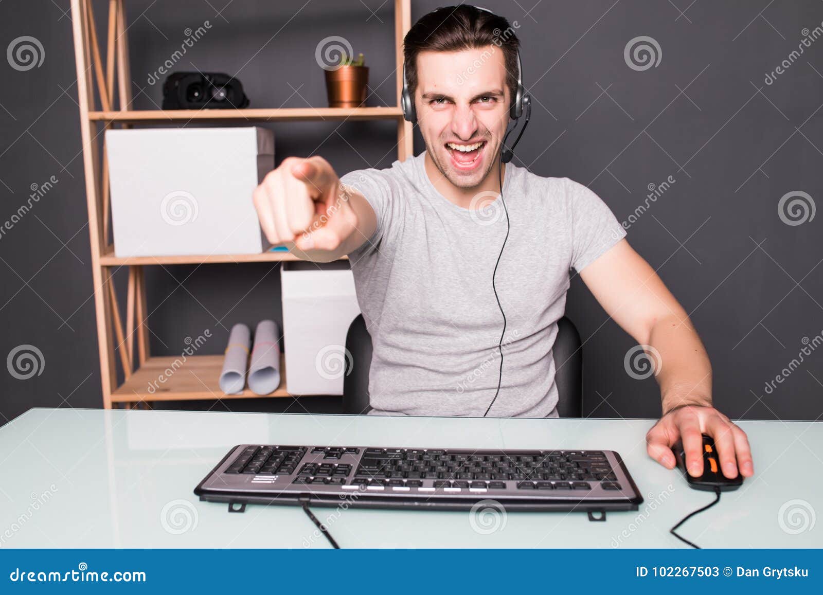 Young Man or Hacker in Headset and Eyeglasses with Pc Computer Playing ...
