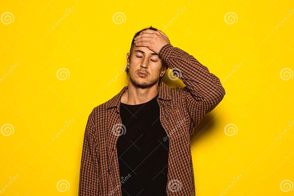 Young Man with Hand on Forehead Stock Photo - Image of beard, portrait ...