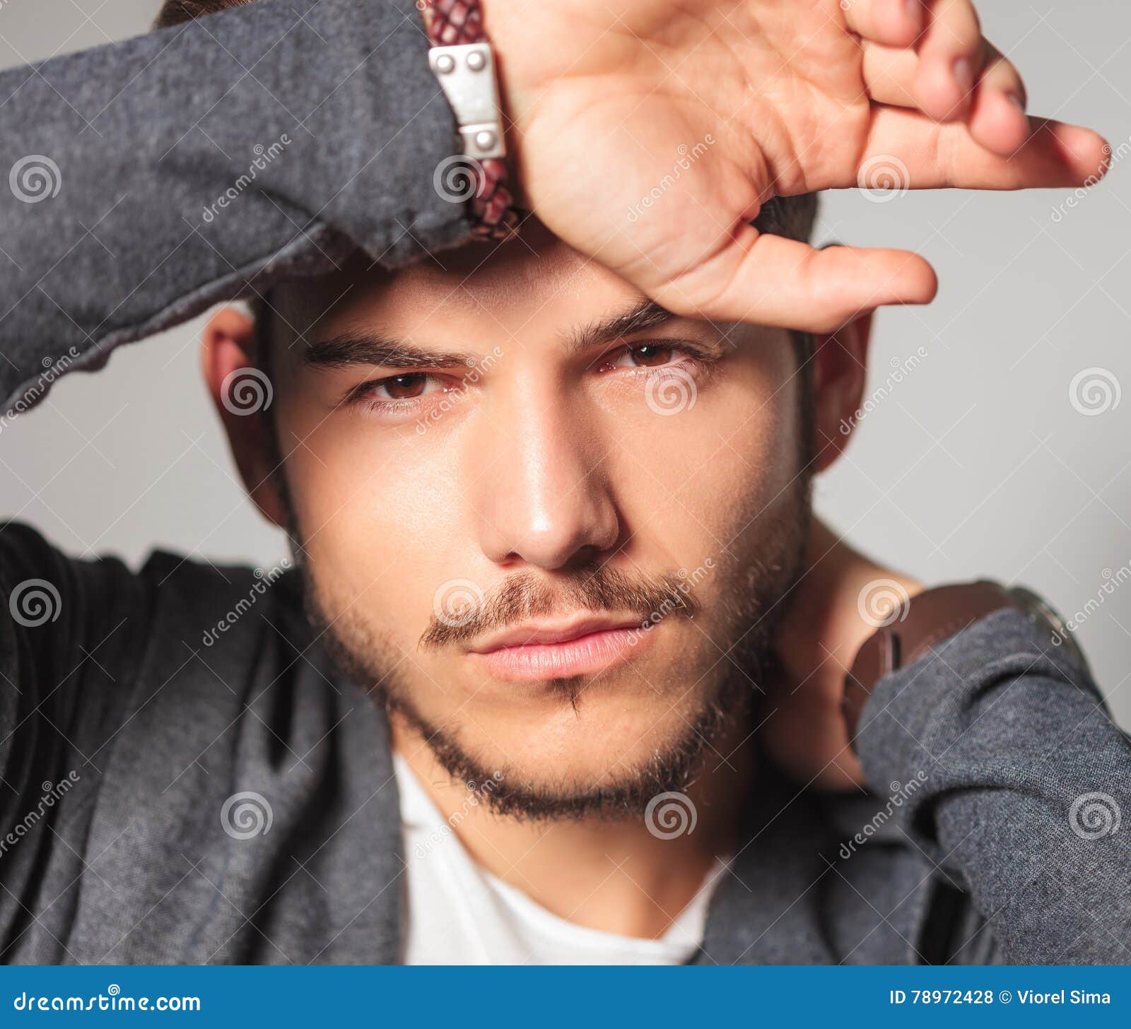 Young Man with Hand on Forehead and Neck Stock Photo - Image of ...