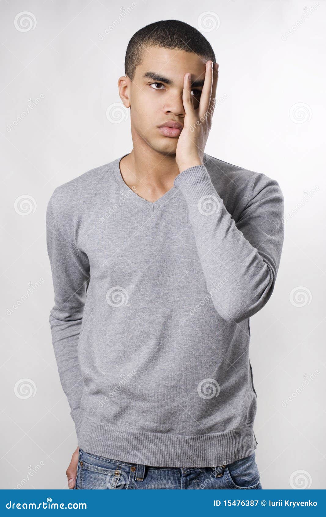 Young Man with Hand Over Eyes Stock Image - Image of fingers, adult ...