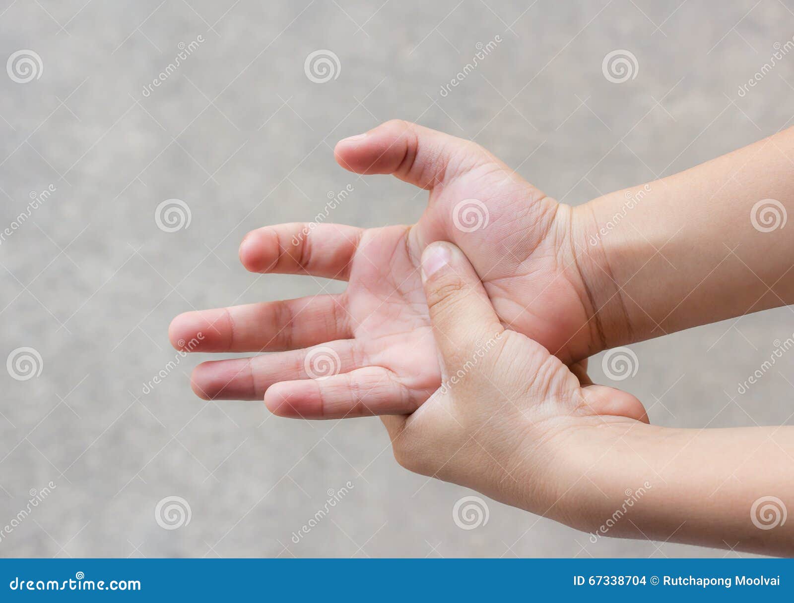 Young man with hand pain stock photo. Image of injury - 67338704