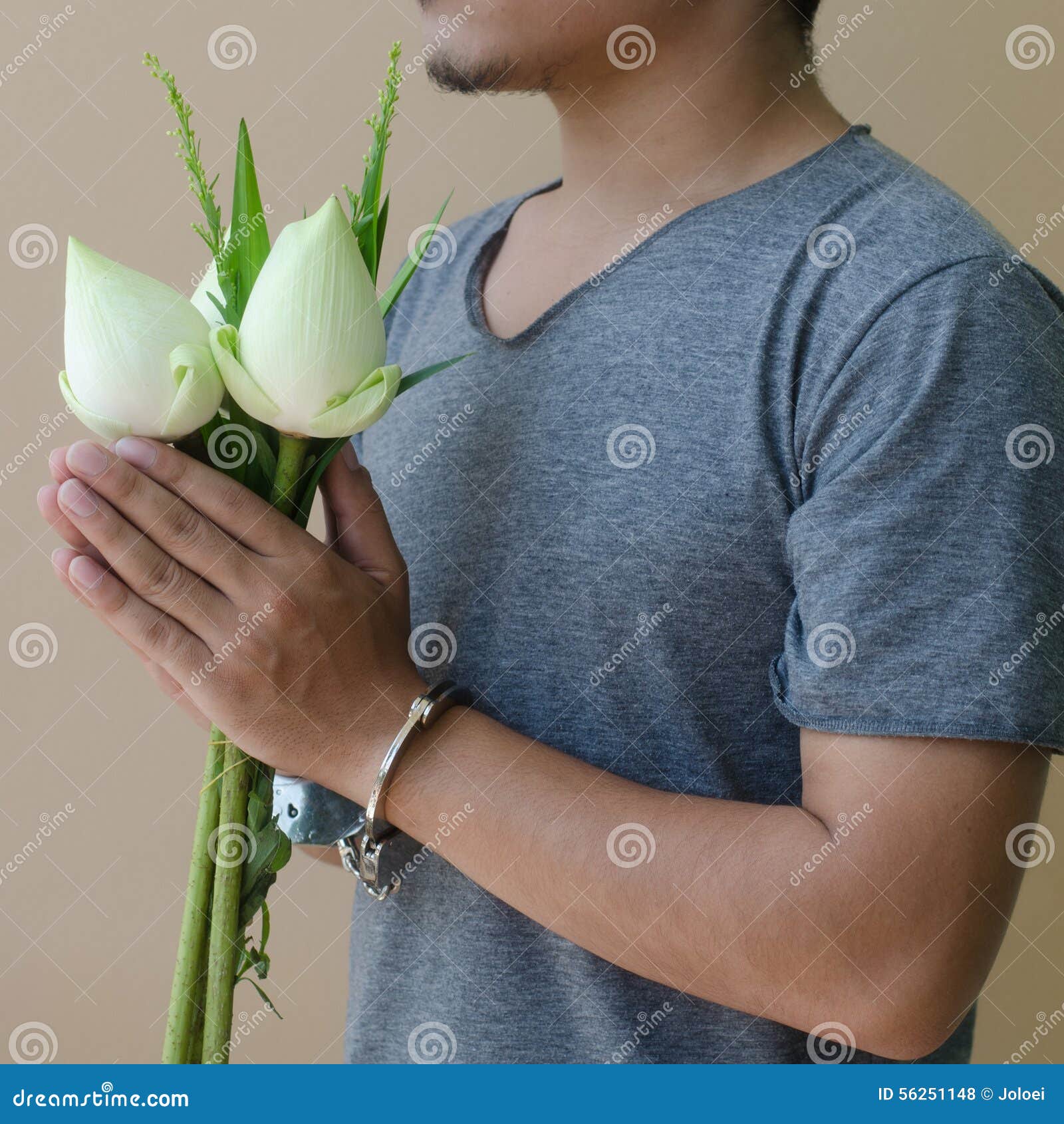 Young Man in Handcuffs and Lotus in Hand Stock Photo - Image of respect ...