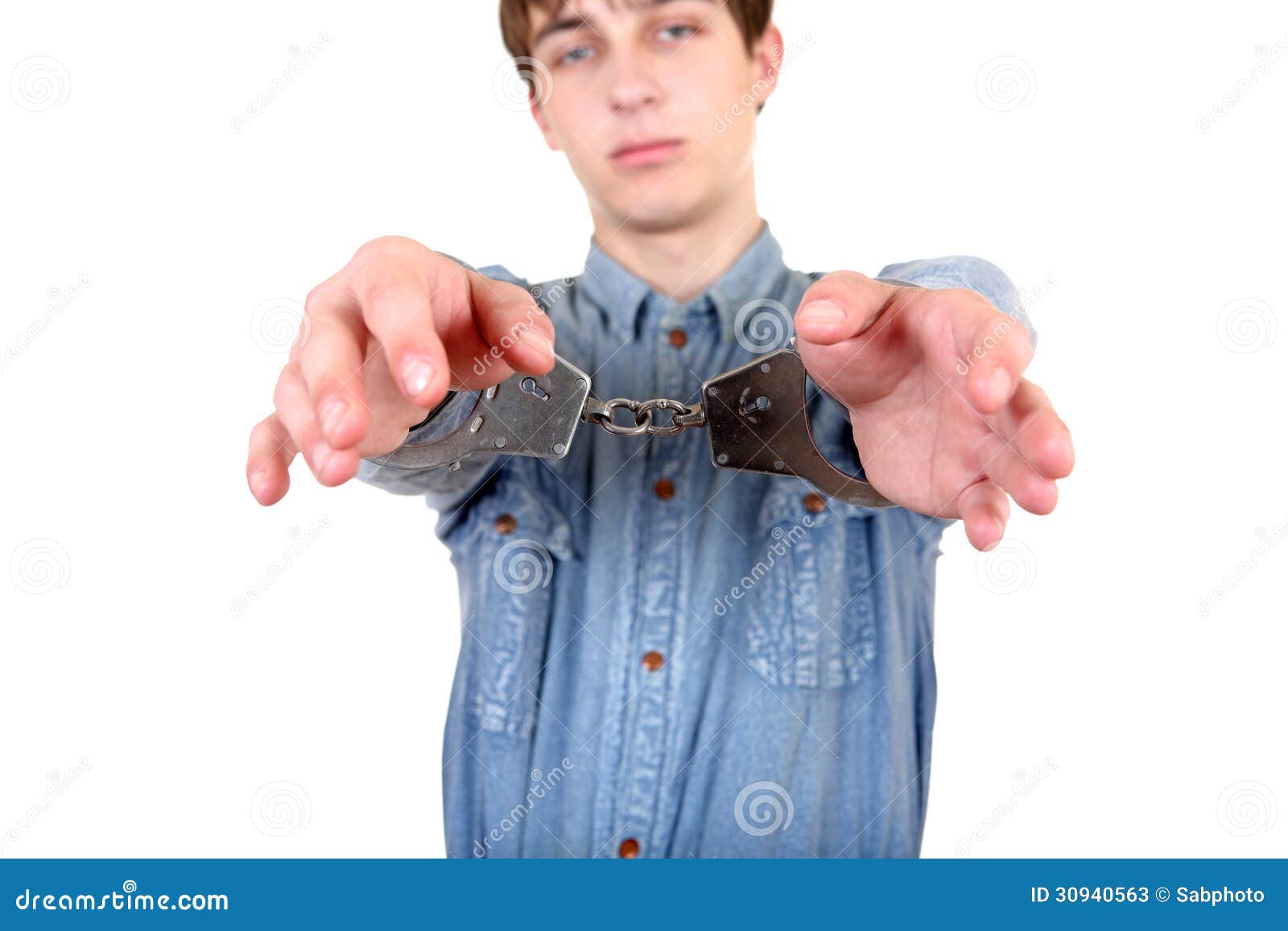 Young Man in Handcuffs stock image. Image of blurred - 30940563