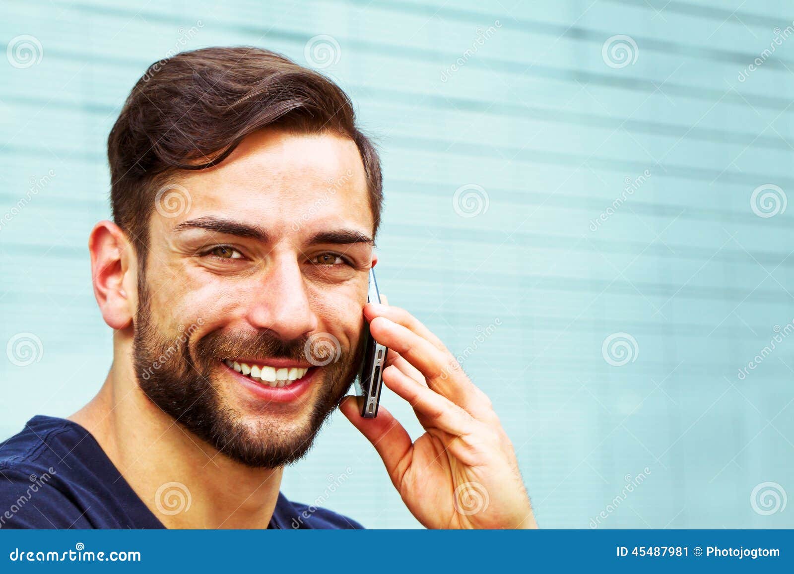 Young man on handy stock image. Image of brunette, cellphone - 45487981