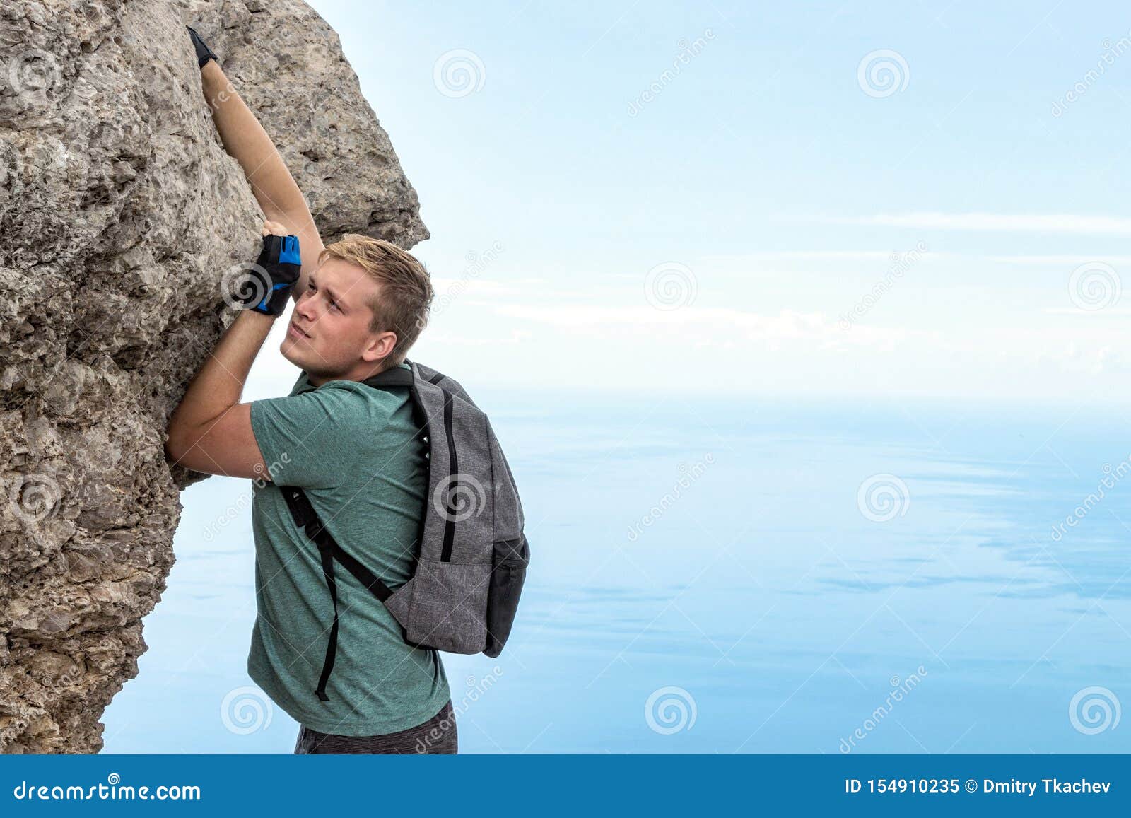 Young Man Hanging on Edge, Climbs Up the Rock Stock Image - Image of ...