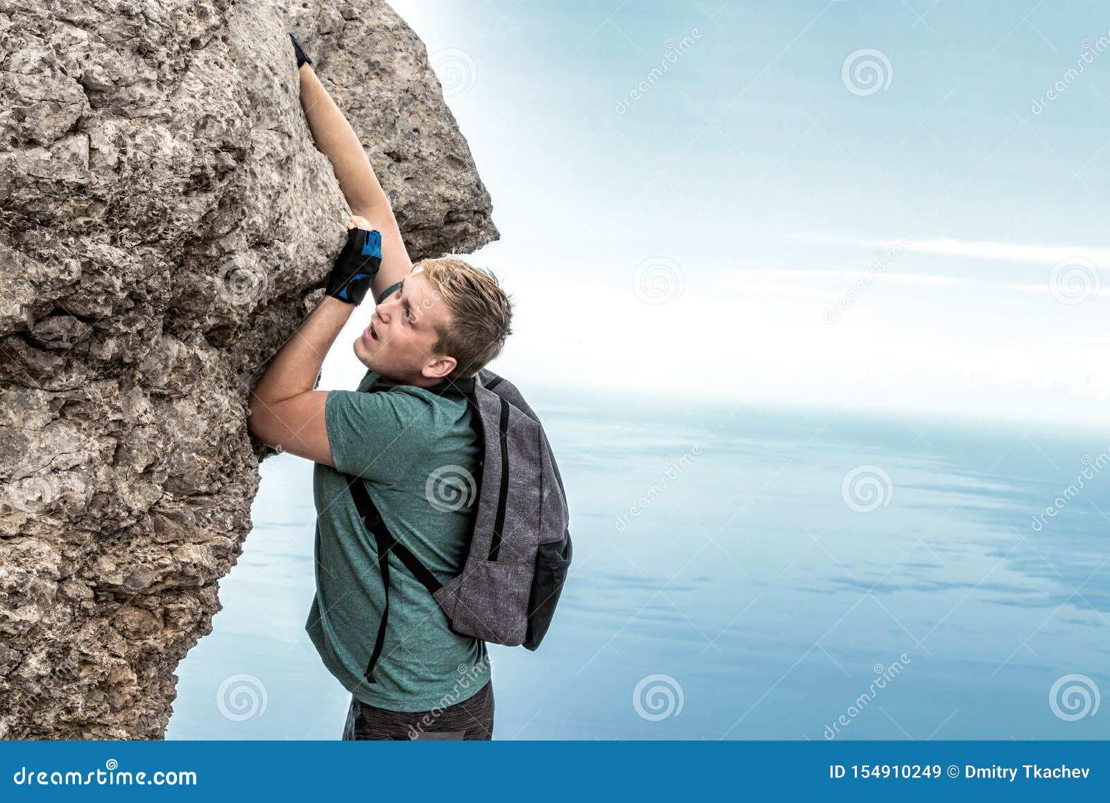 Young Man Hanging on Edge, Climbs Up the Rock Stock Image - Image of ...