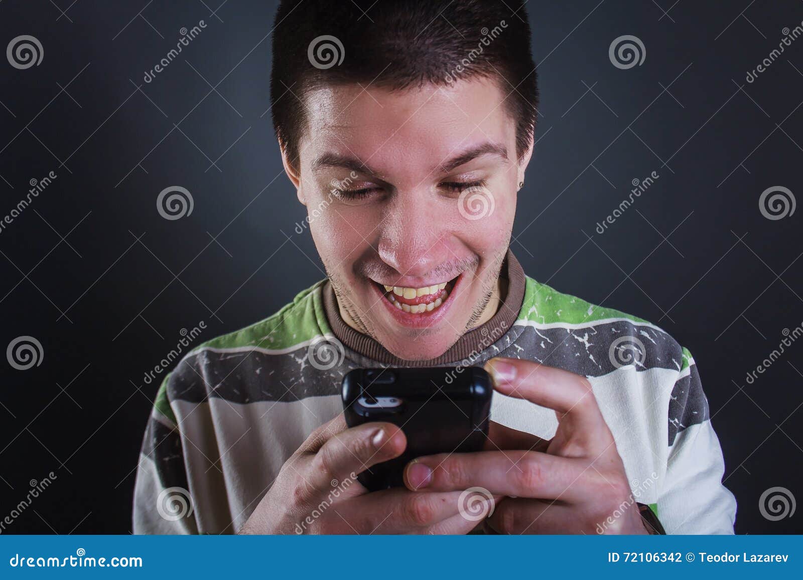 Young Man Happy Reading a Message Stock Photo - Image of reading ...