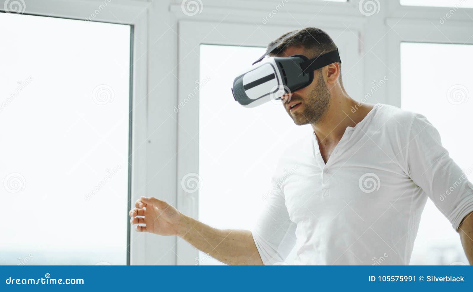 Young Man Have VR Experience with Virtual Reality Headset Using Hands ...