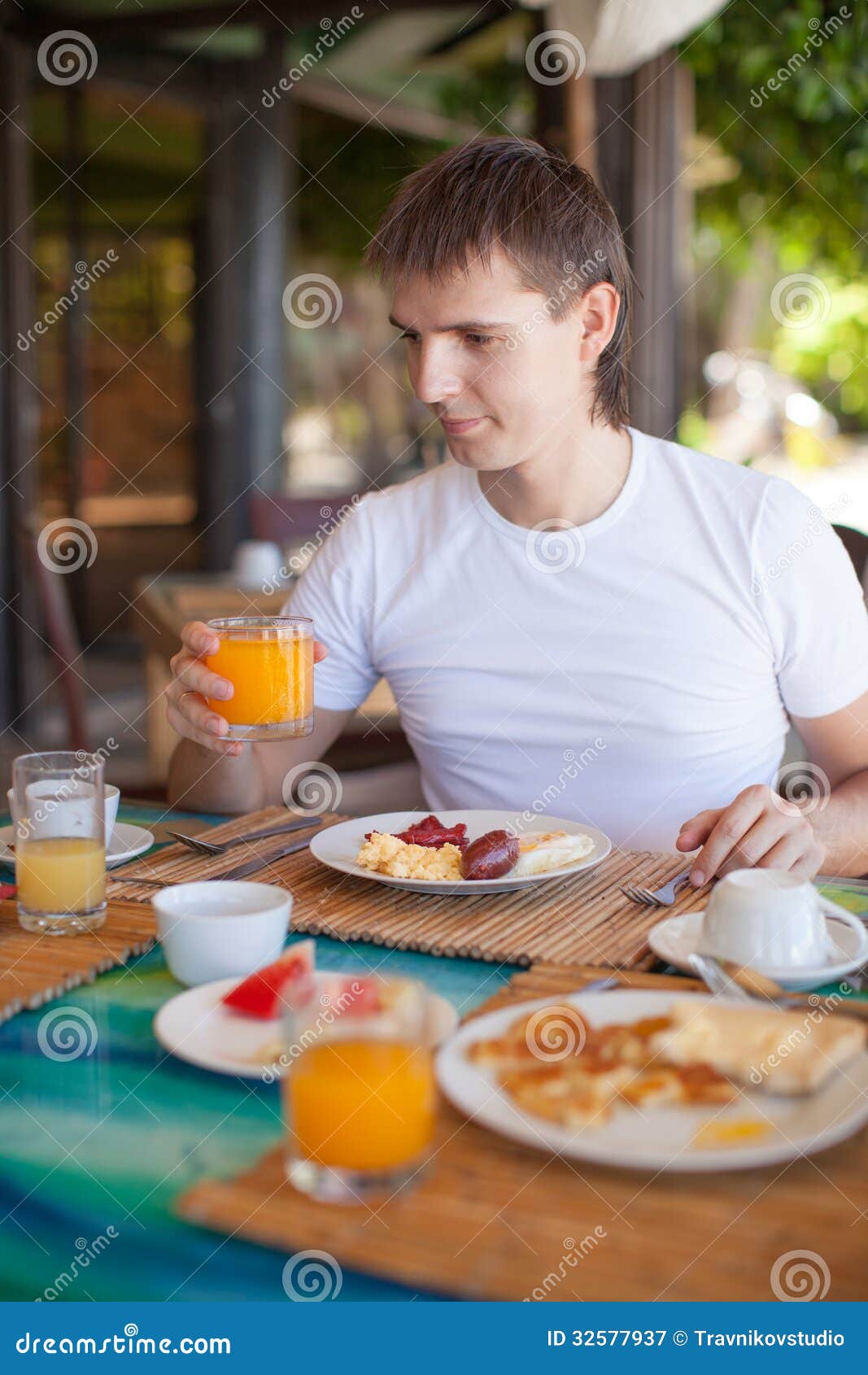 Young Man Having Breakfast At Resort Restaurant Stock Image - Image of ...