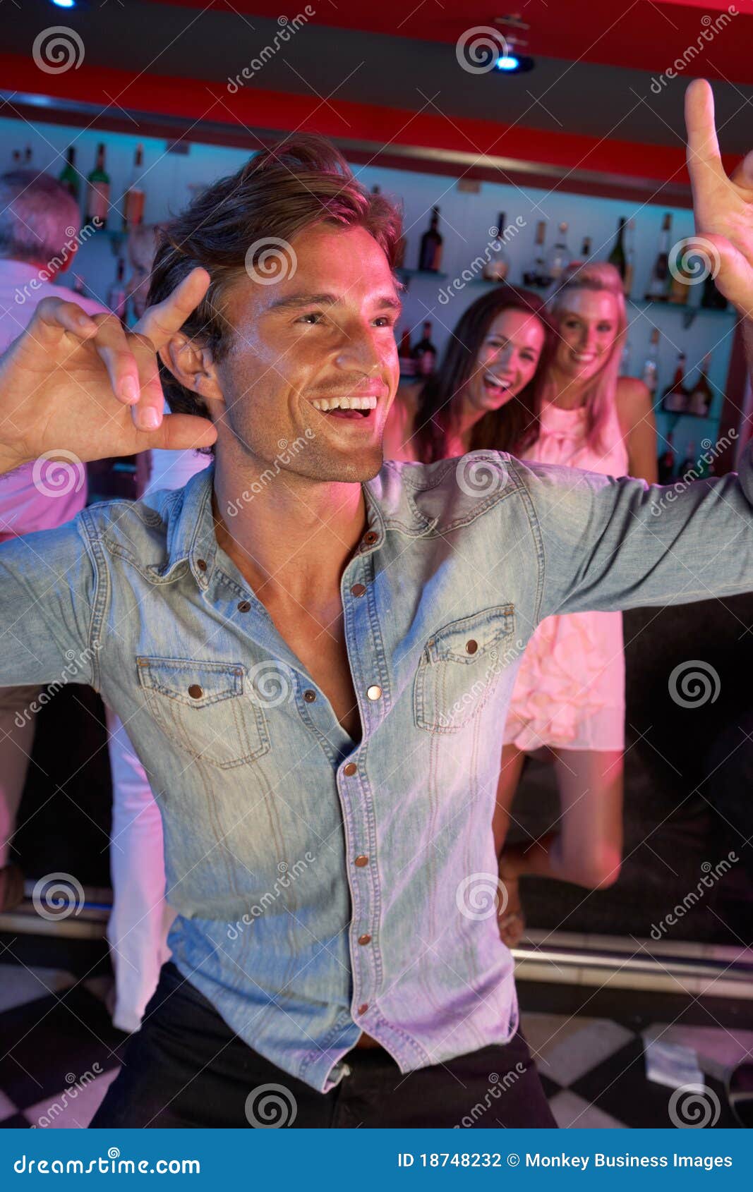 Young Man Having Fun in Busy Bar Stock Photo - Image of busy, enjoying ...