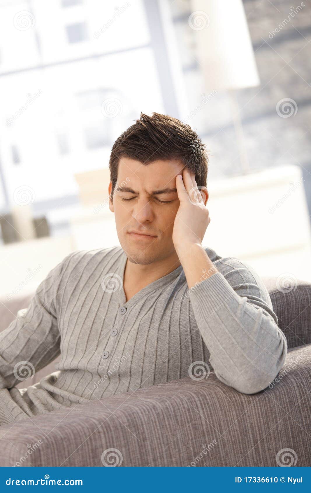 Young man having headache stock photo. Image of goodlooking - 17336610