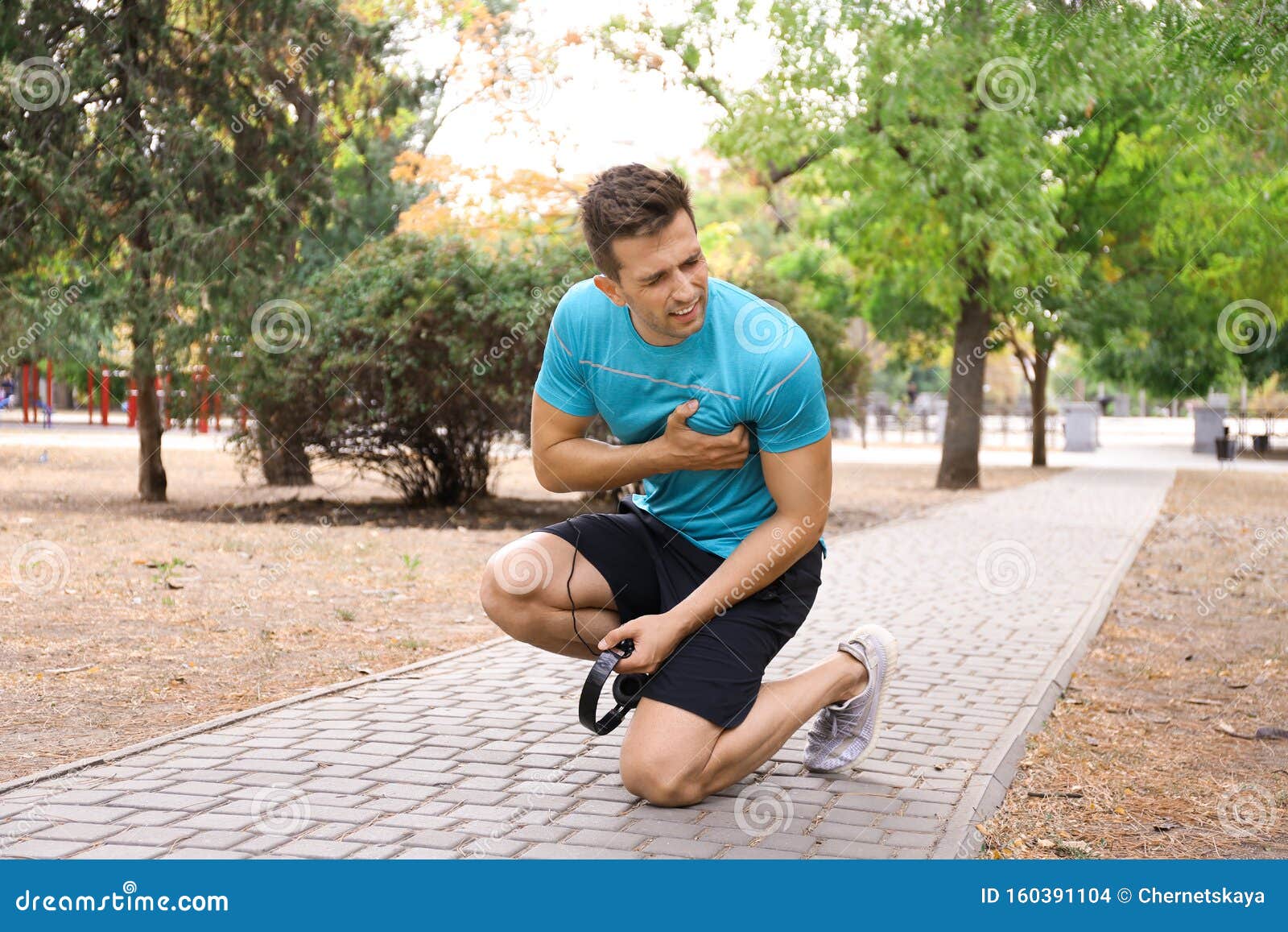 Young Man Having Heart Attack while Running Stock Photo - Image of ...