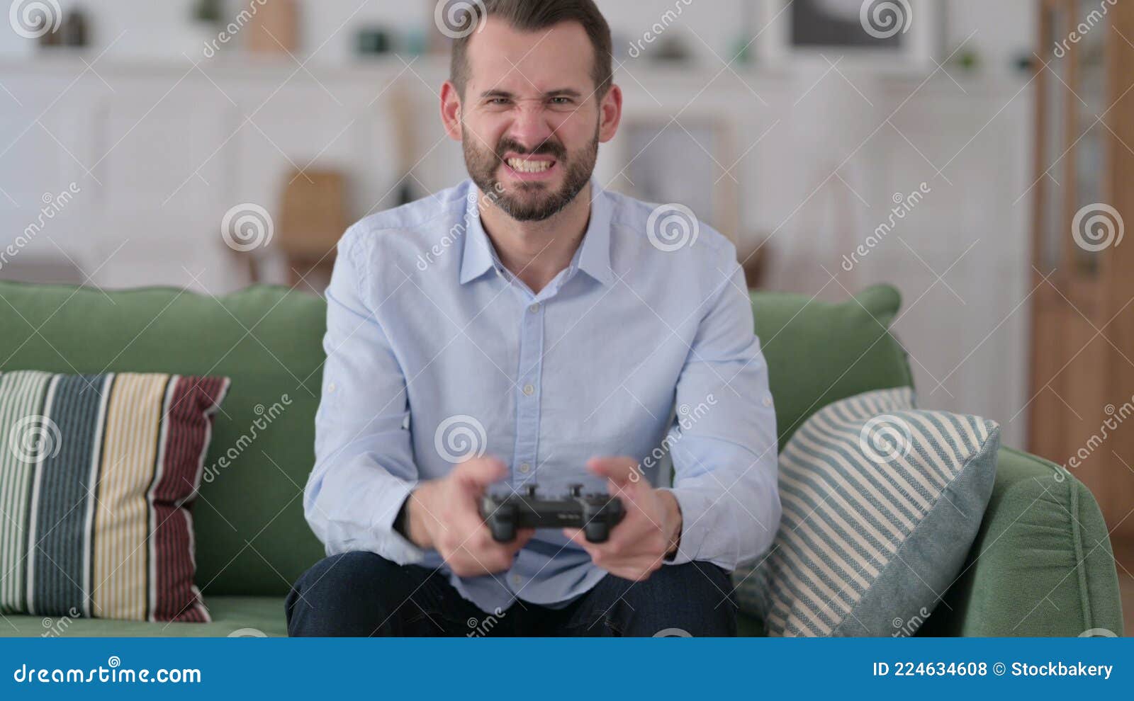 Young Man Having Loss on Video Game on Sofa Stock Photo - Image of play ...