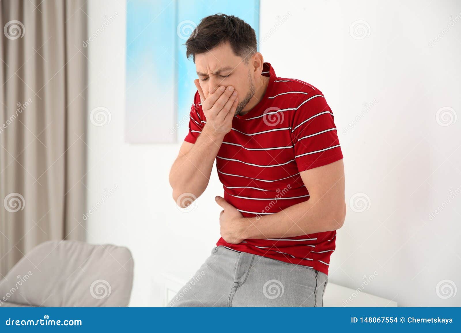 Young Man Having Nausea at Home Stock Photo - Image of medicine ...