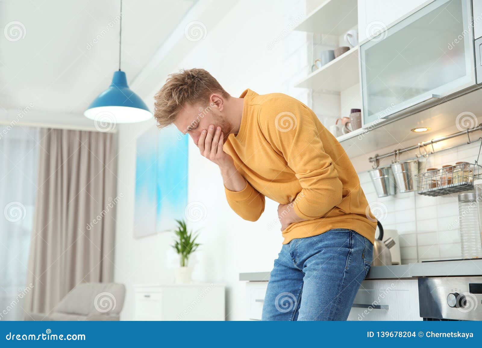 Young Man Having Nausea in Kitchen. Stock Photo - Image of disease ...