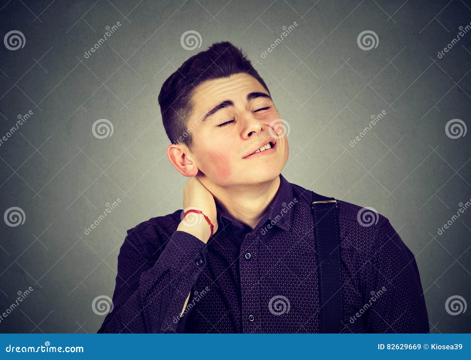 Young man having neck pain stock image. Image of male - 82629669
