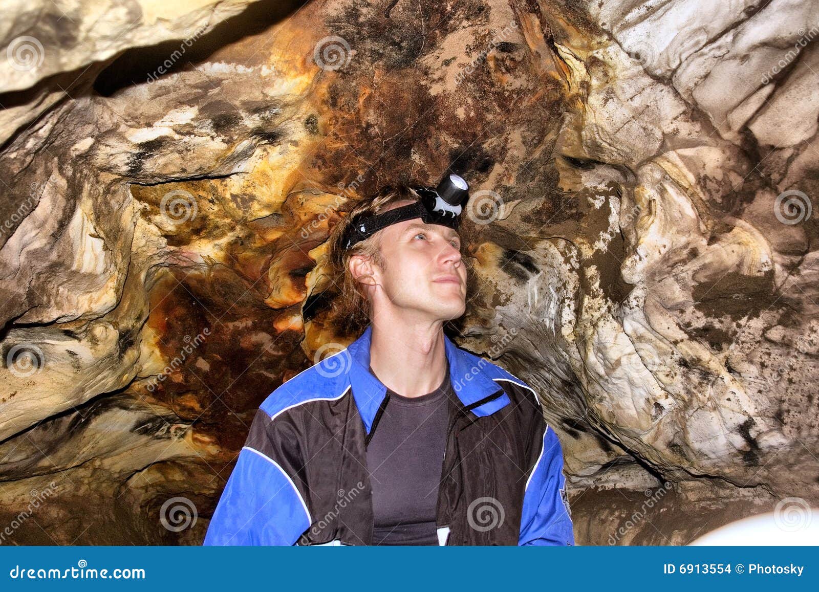 Young Man With Headlamp In A Cave Stock Photo | CartoonDealer.com #6913554