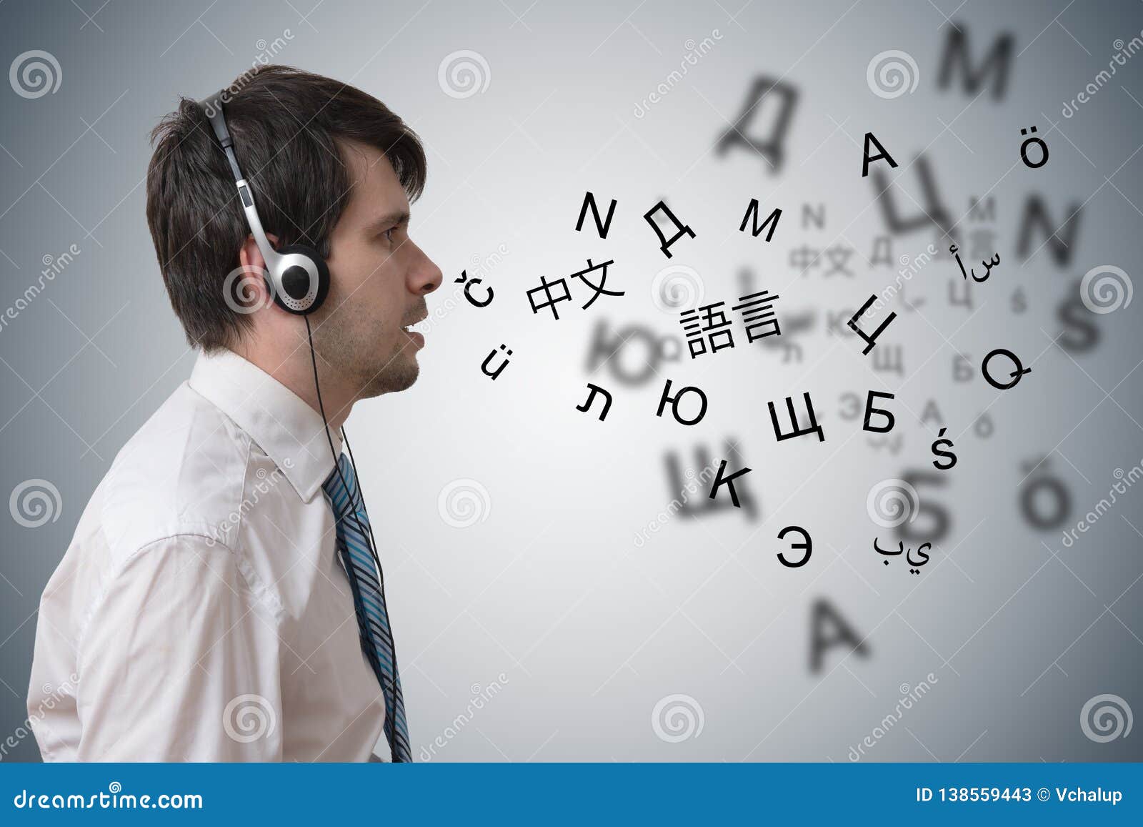 Young Man with Headphones is Learning Different Foreign Languages ...