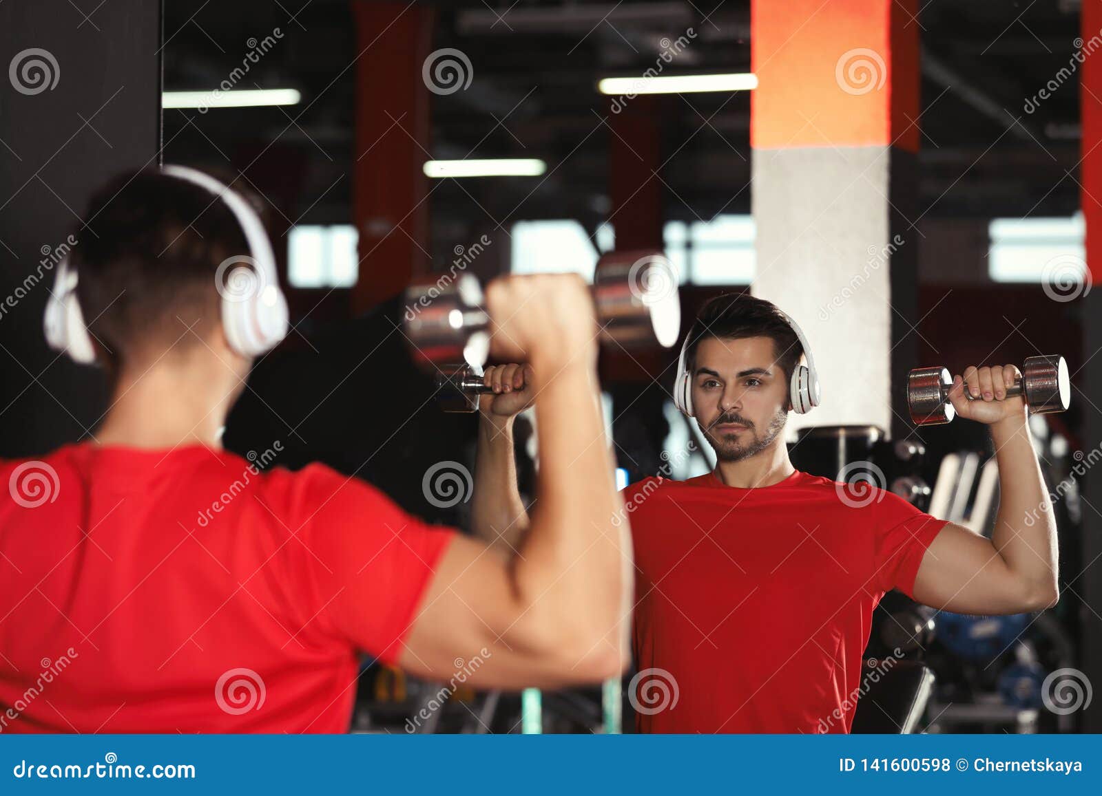 Young Man with Headphones Listening To Music and Working Out Stock ... Young Man with Headphones Listening To Music and Working Out Stock ...