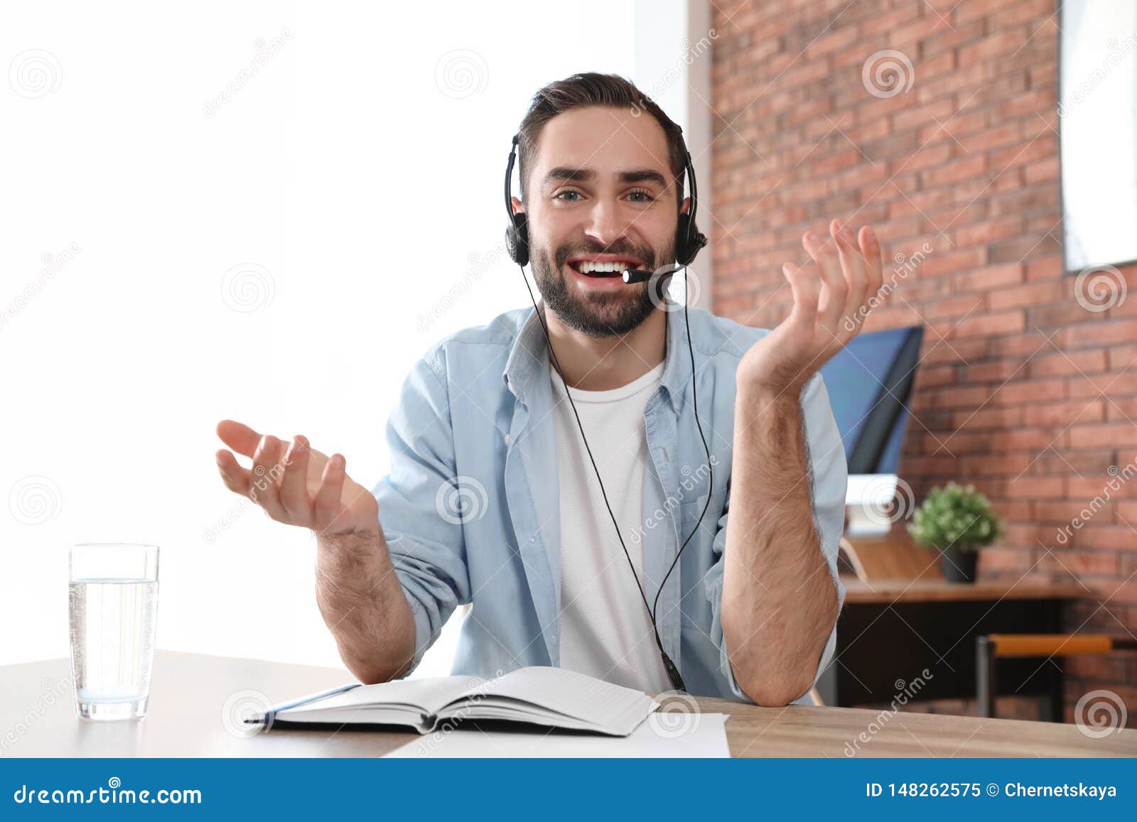 Young Man with Headset Looking at Camera and Using Video Chat Stock ...