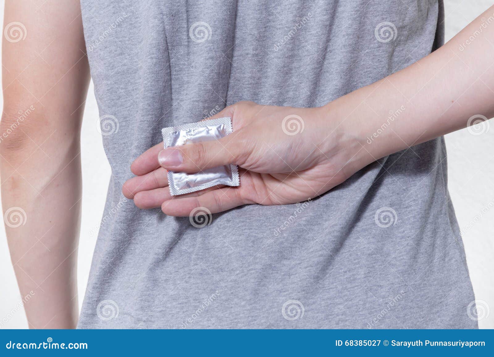 Condom In Young Woman Hand Holding Give Safe Sex Concept Prevent