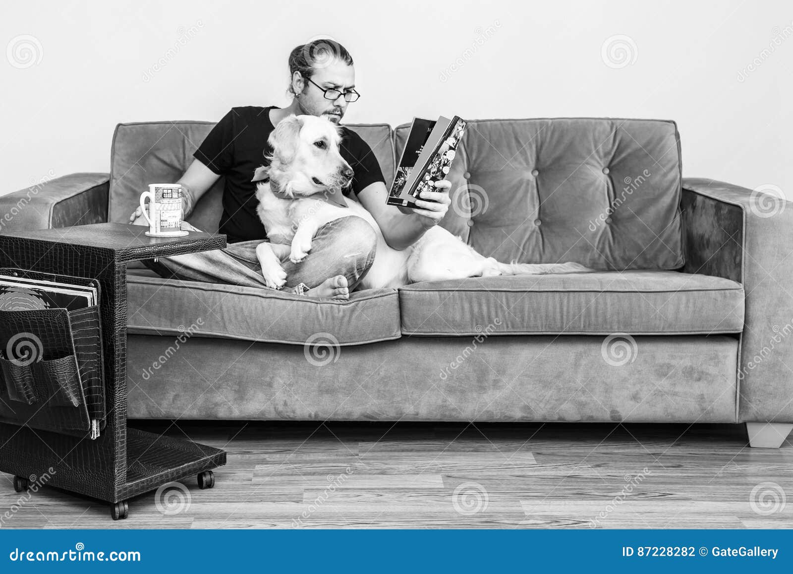 Young Man Reading with Dog S Companionship Editorial Photography ...