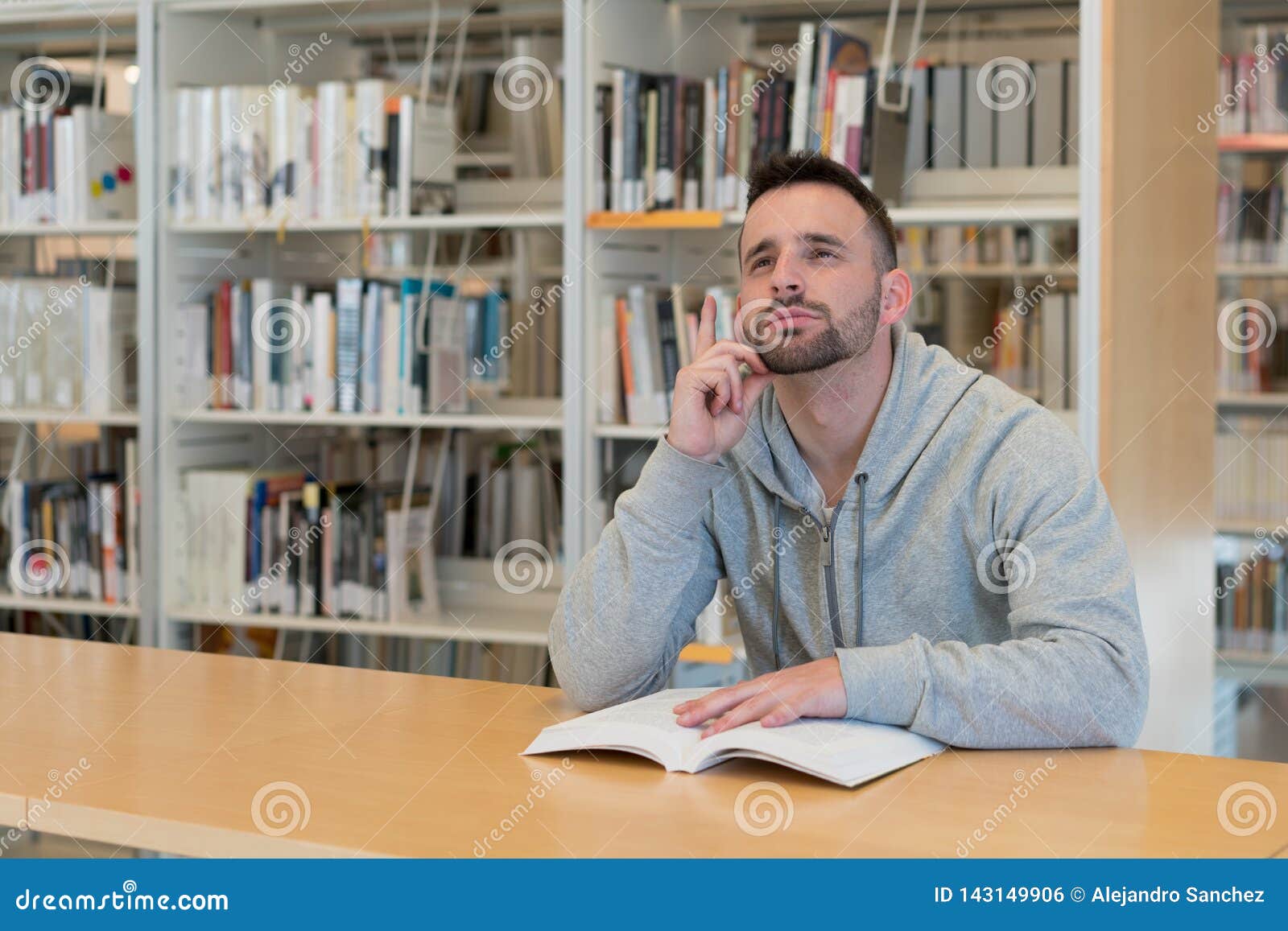 Young Man with His Finger Raised High Thinking about Possible Answers ...
